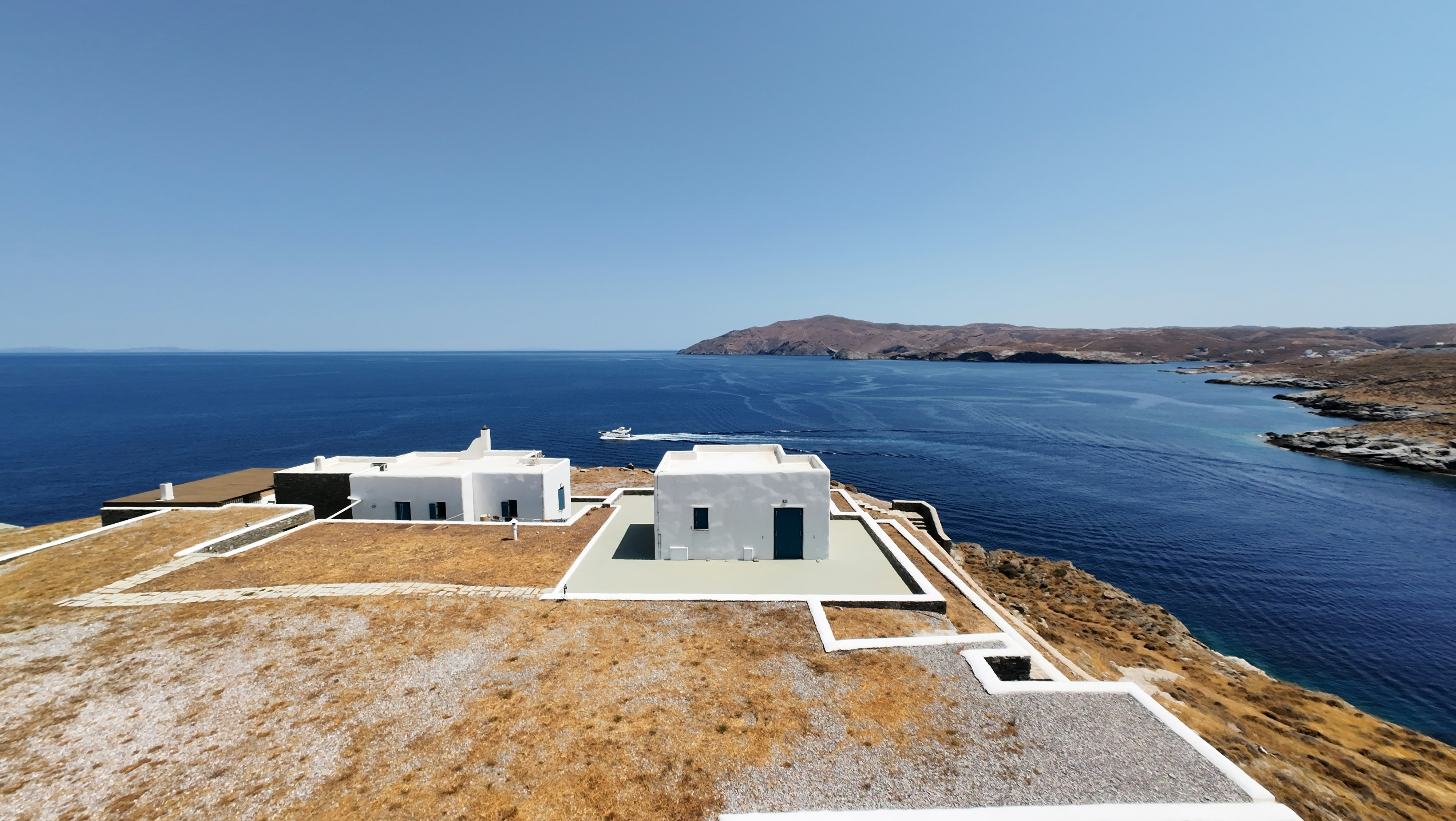 Whitewashed Studios Overlooking Turquoise Waters