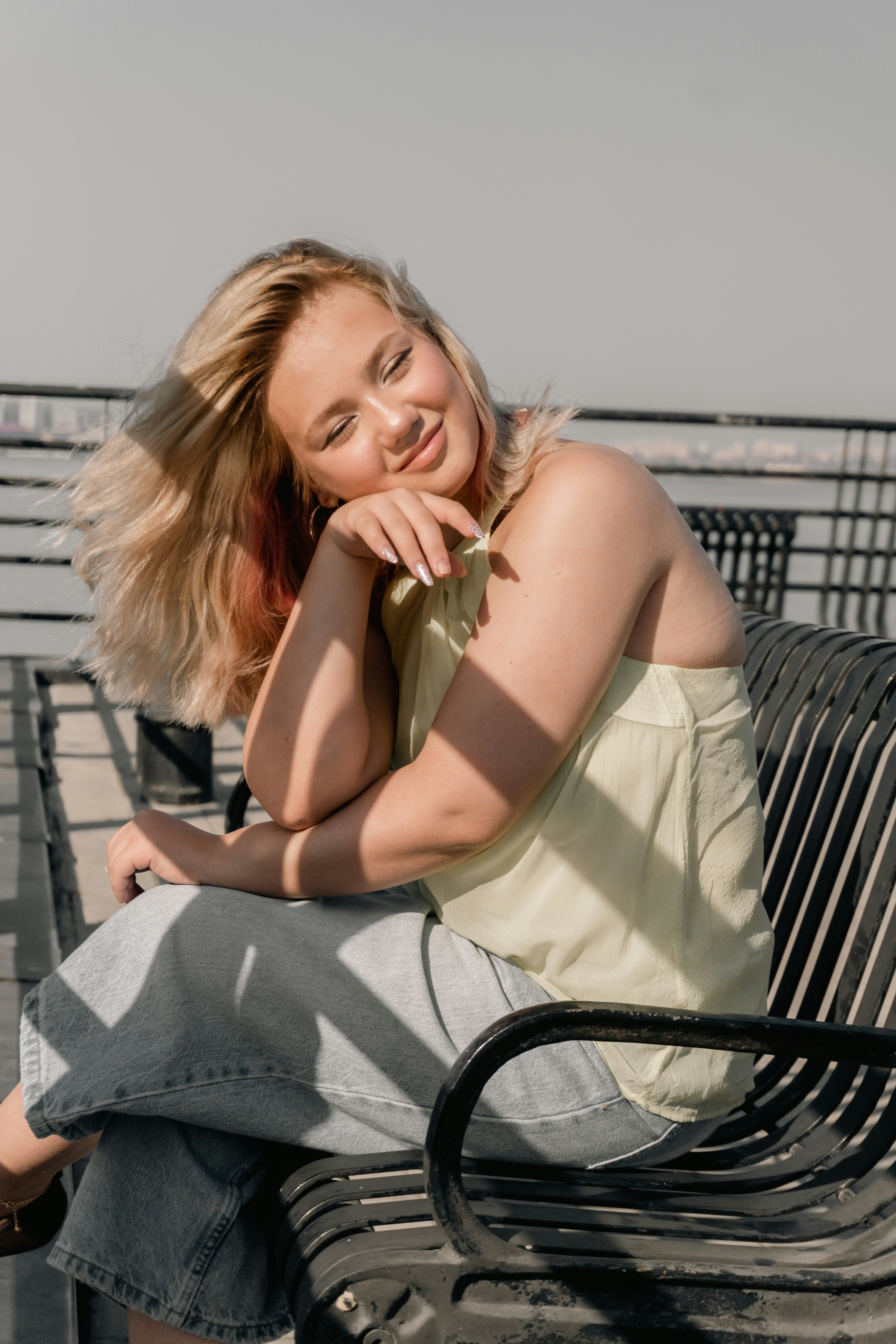 Sunlit Smile on a Seaside Bench