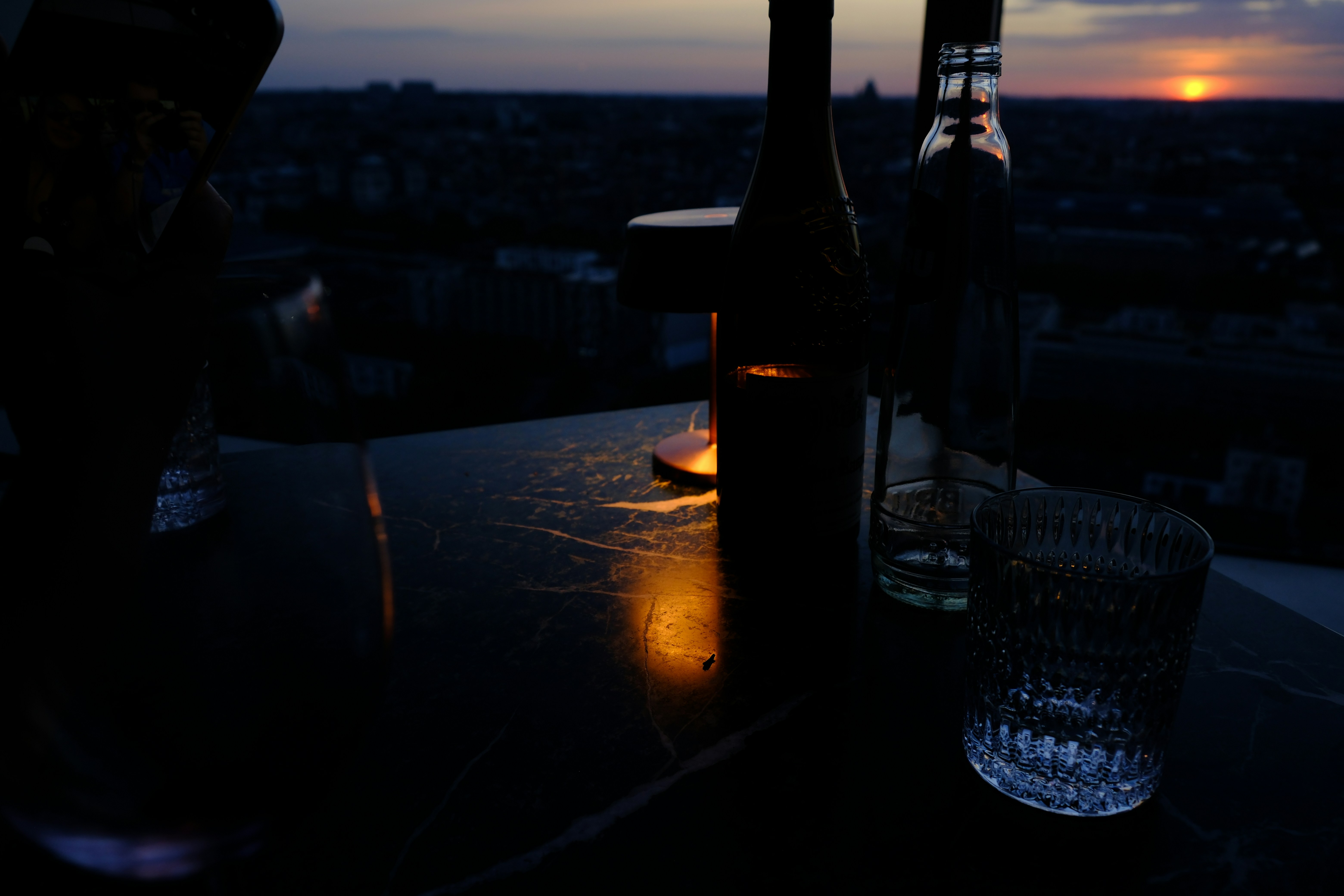 Dusk Glow on a Dim Rooftop Bar