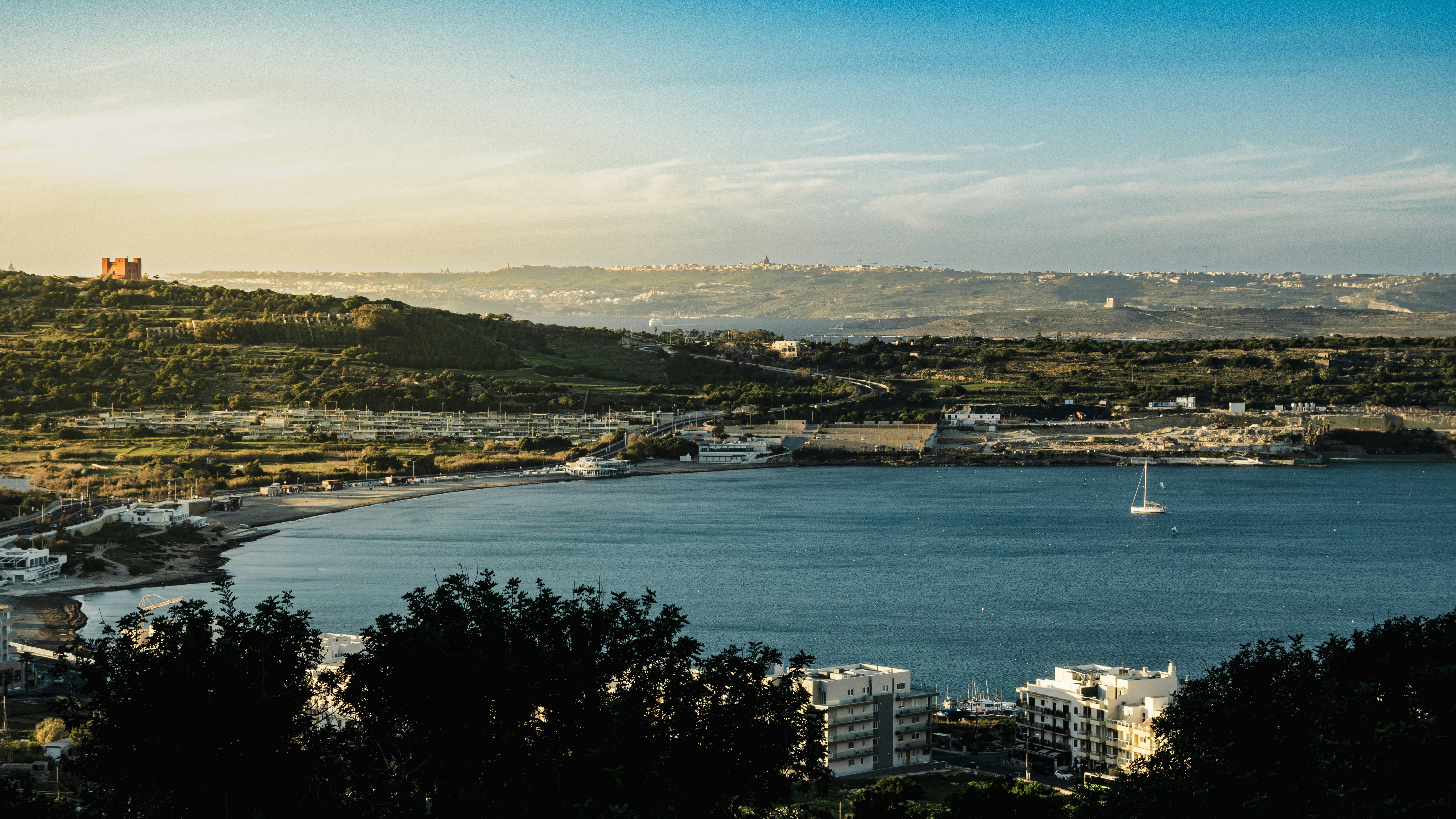 Sunlit Cove: A Quiet Town Amid Soaring Hills