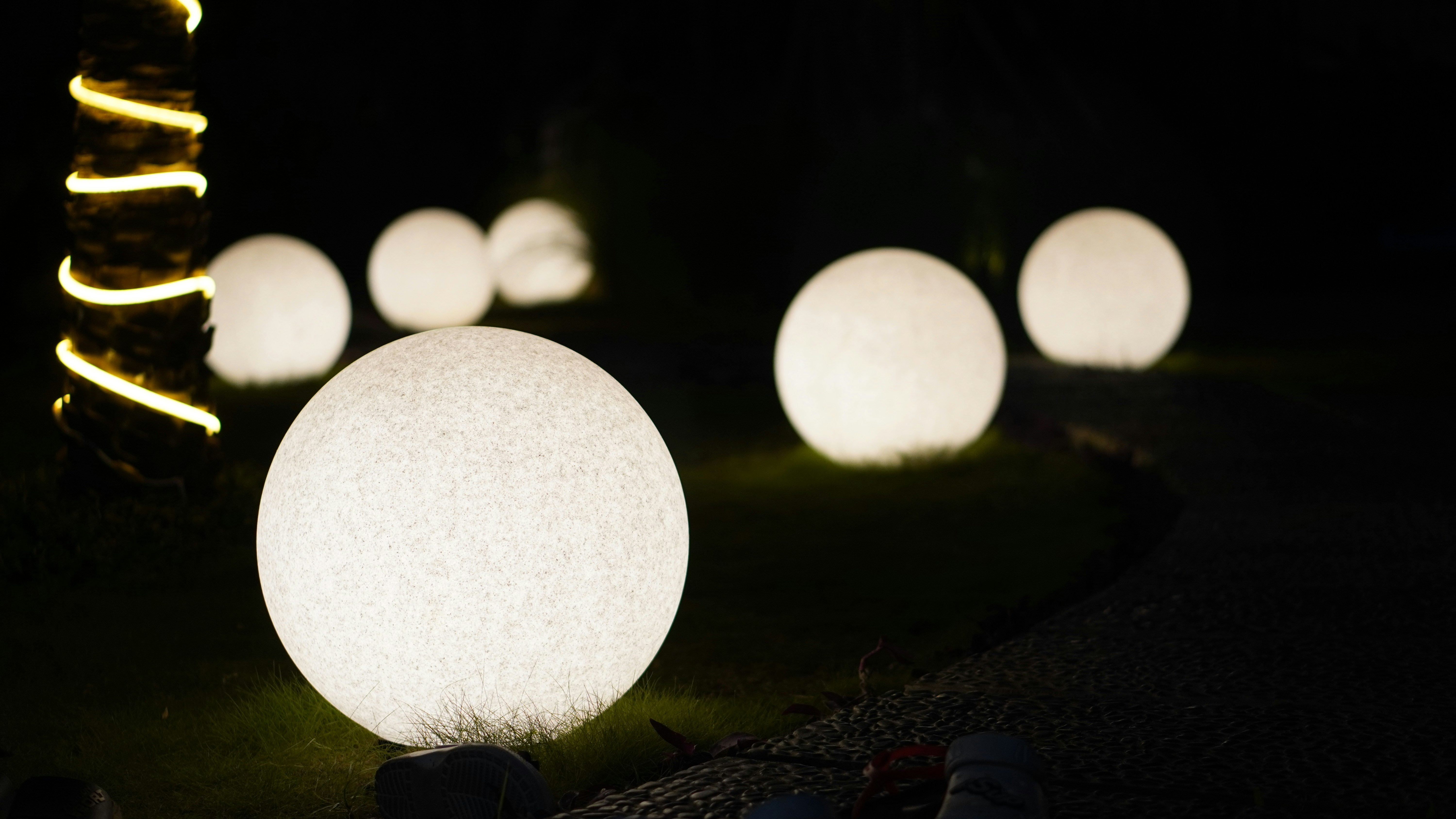 Glowing Orbs on a Twilight Lawn