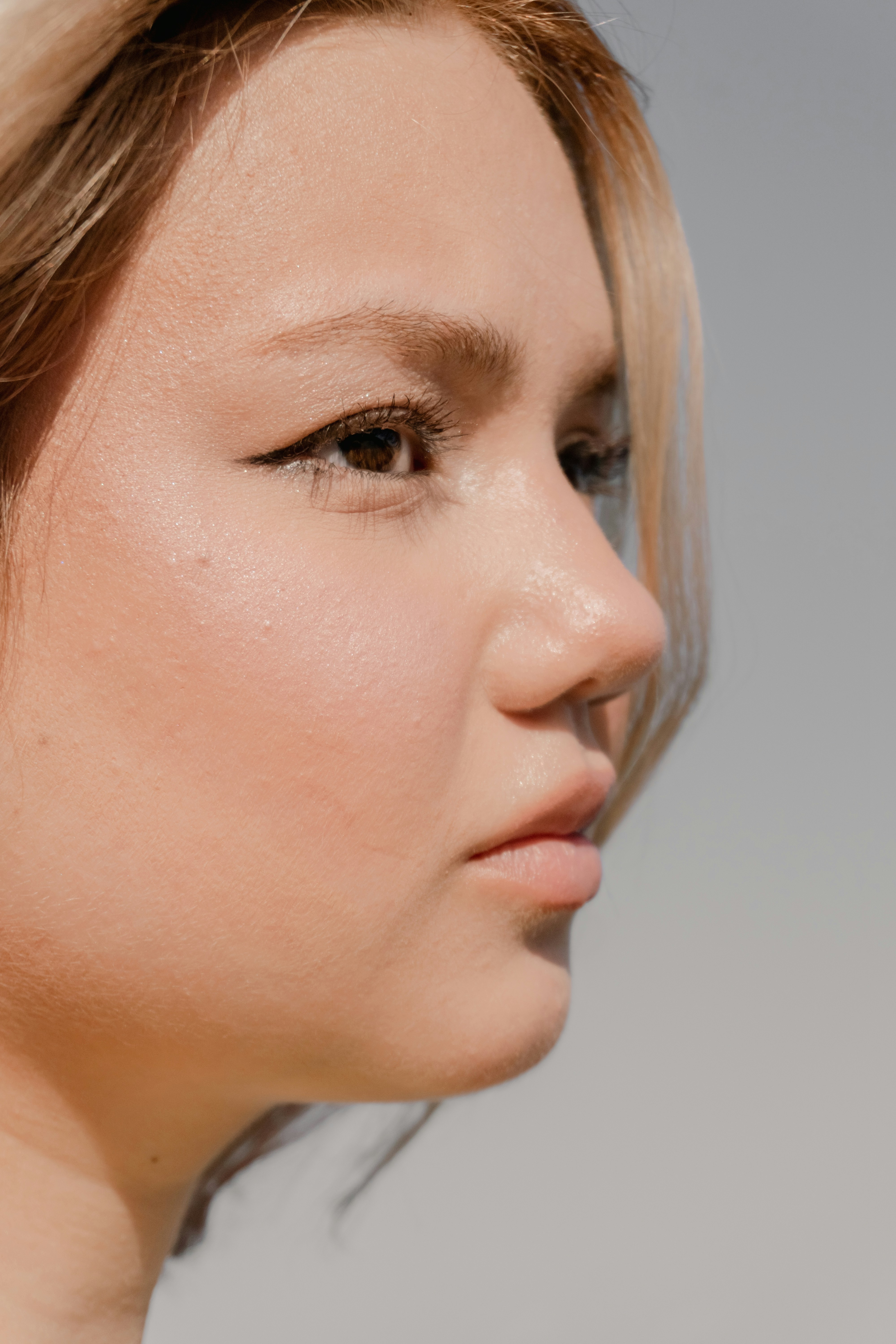 Side Portrait in Soft Light: A Calm Gaze on a Quiet Horizon