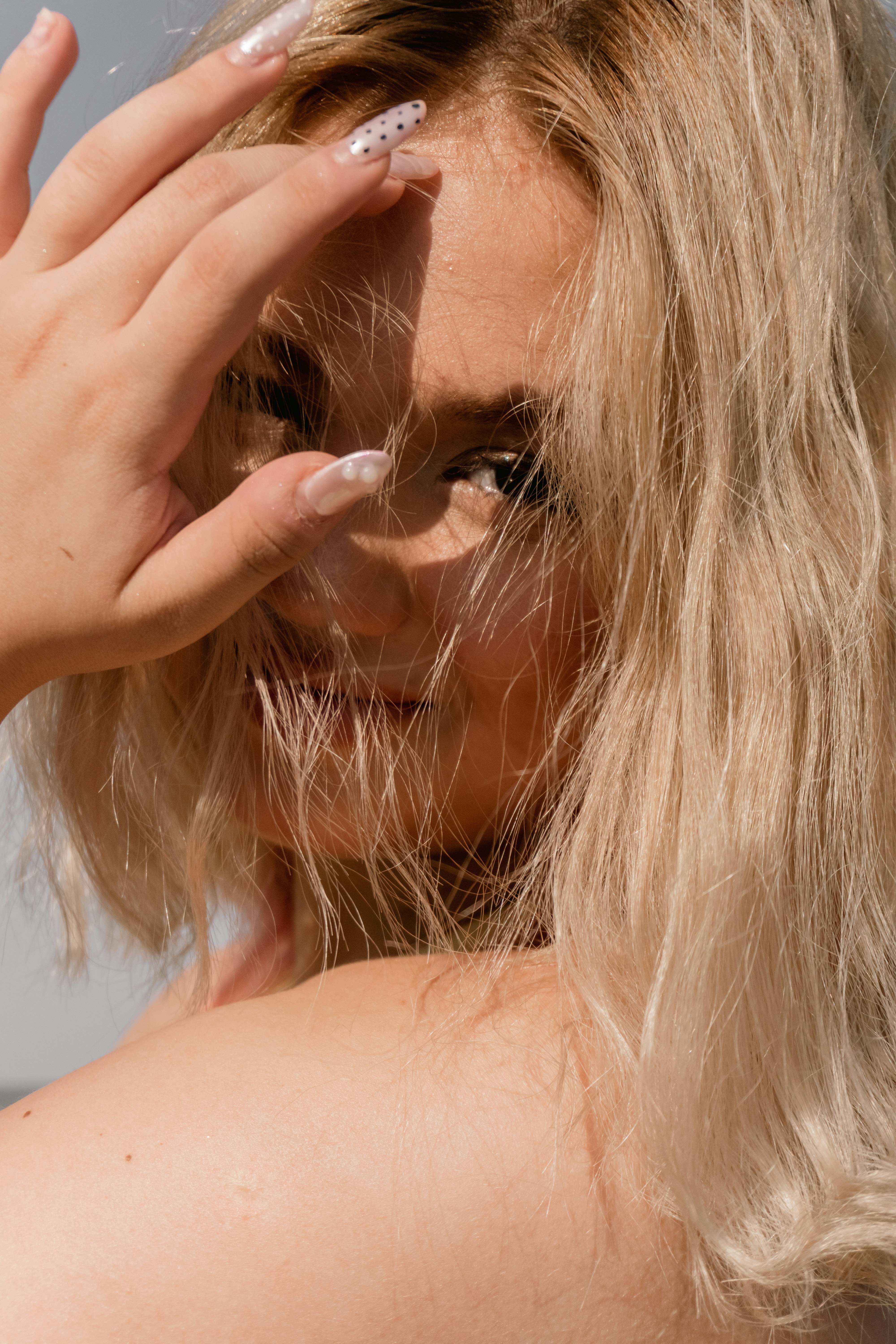 Sunlit Gaze Through Wind-Swept Strands