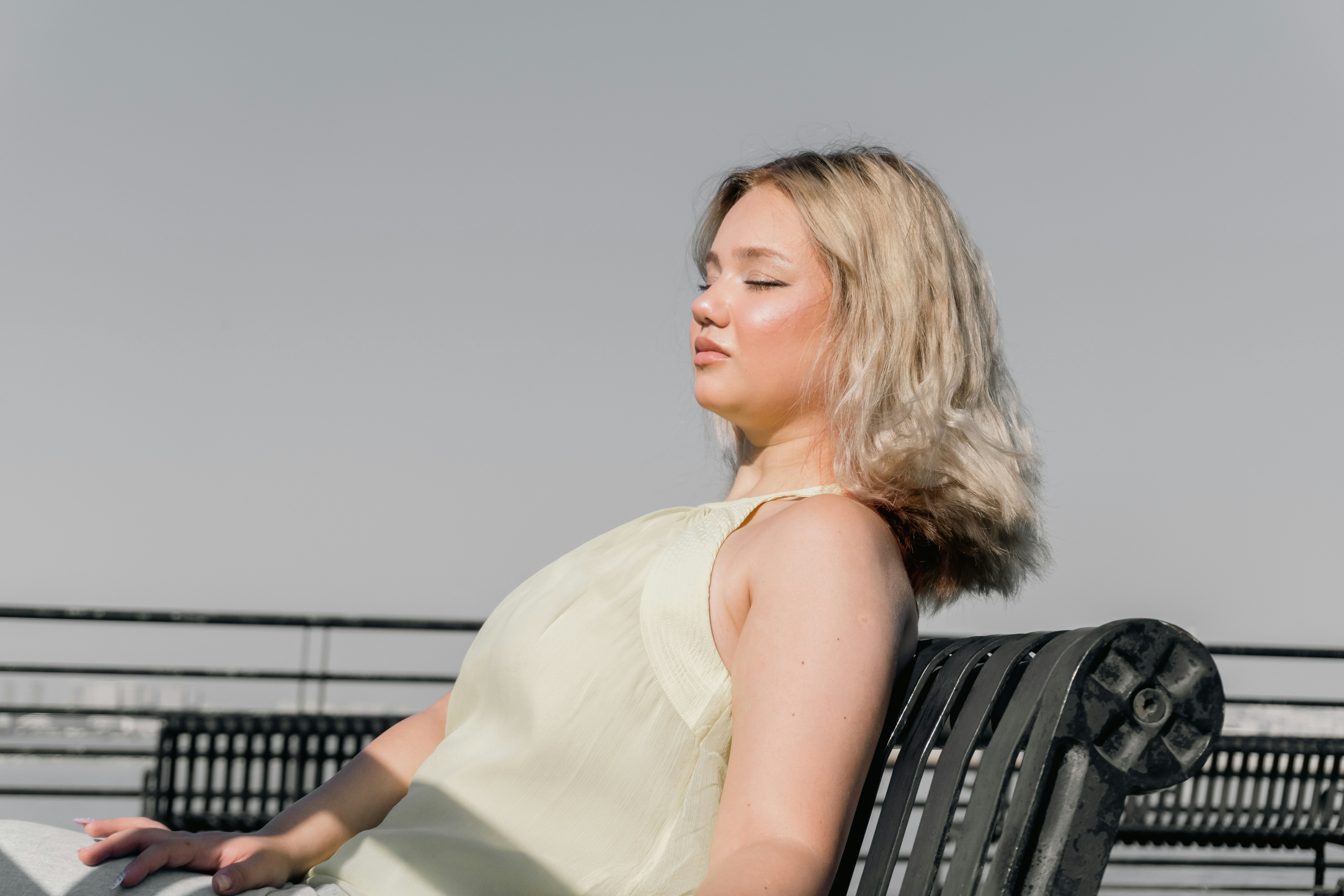 Sunlit Quiet: A Moment on the Rooftop Bench