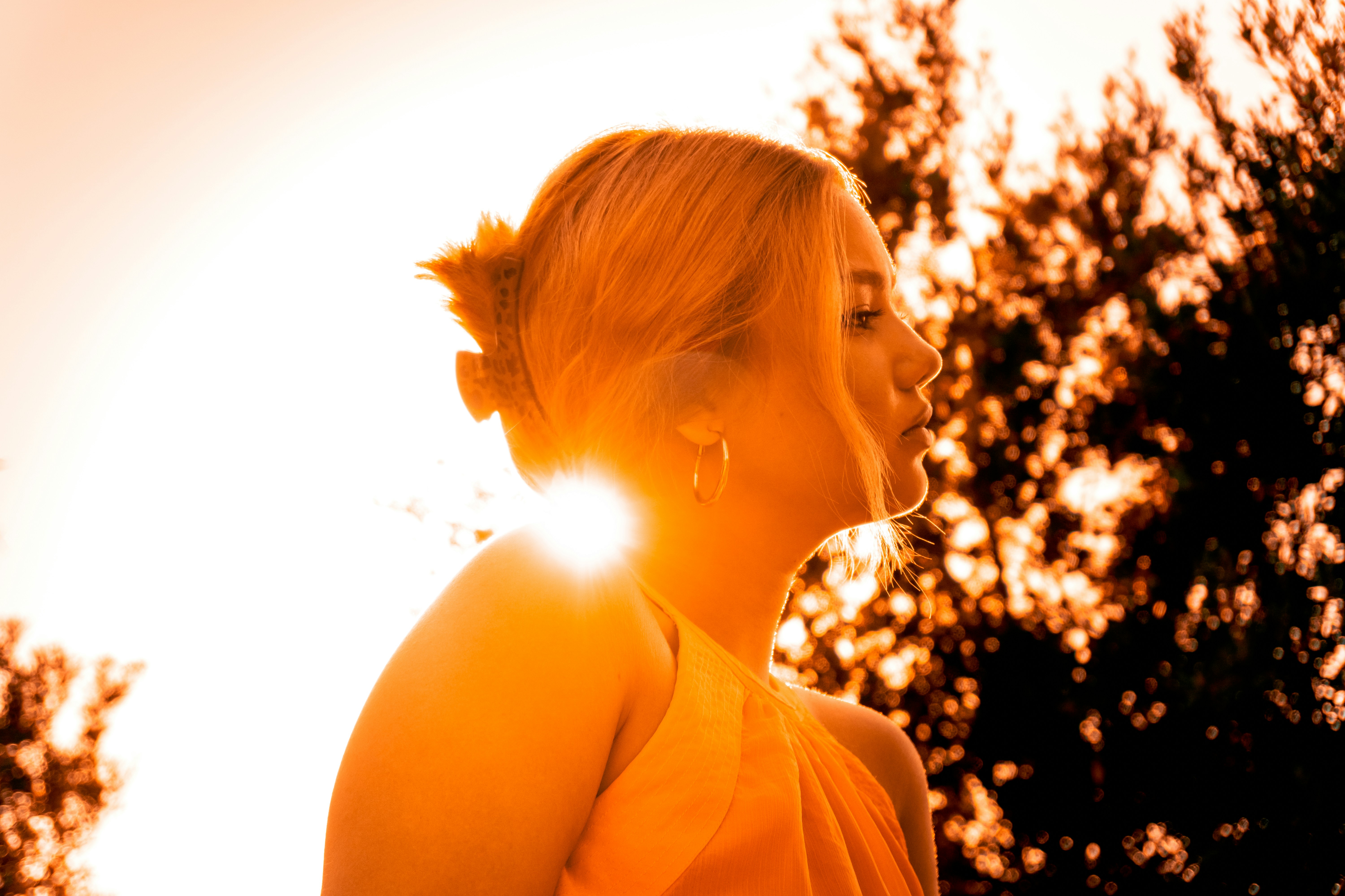 Golden Portrait: Sunlit Profile in a Fiery Backdrop