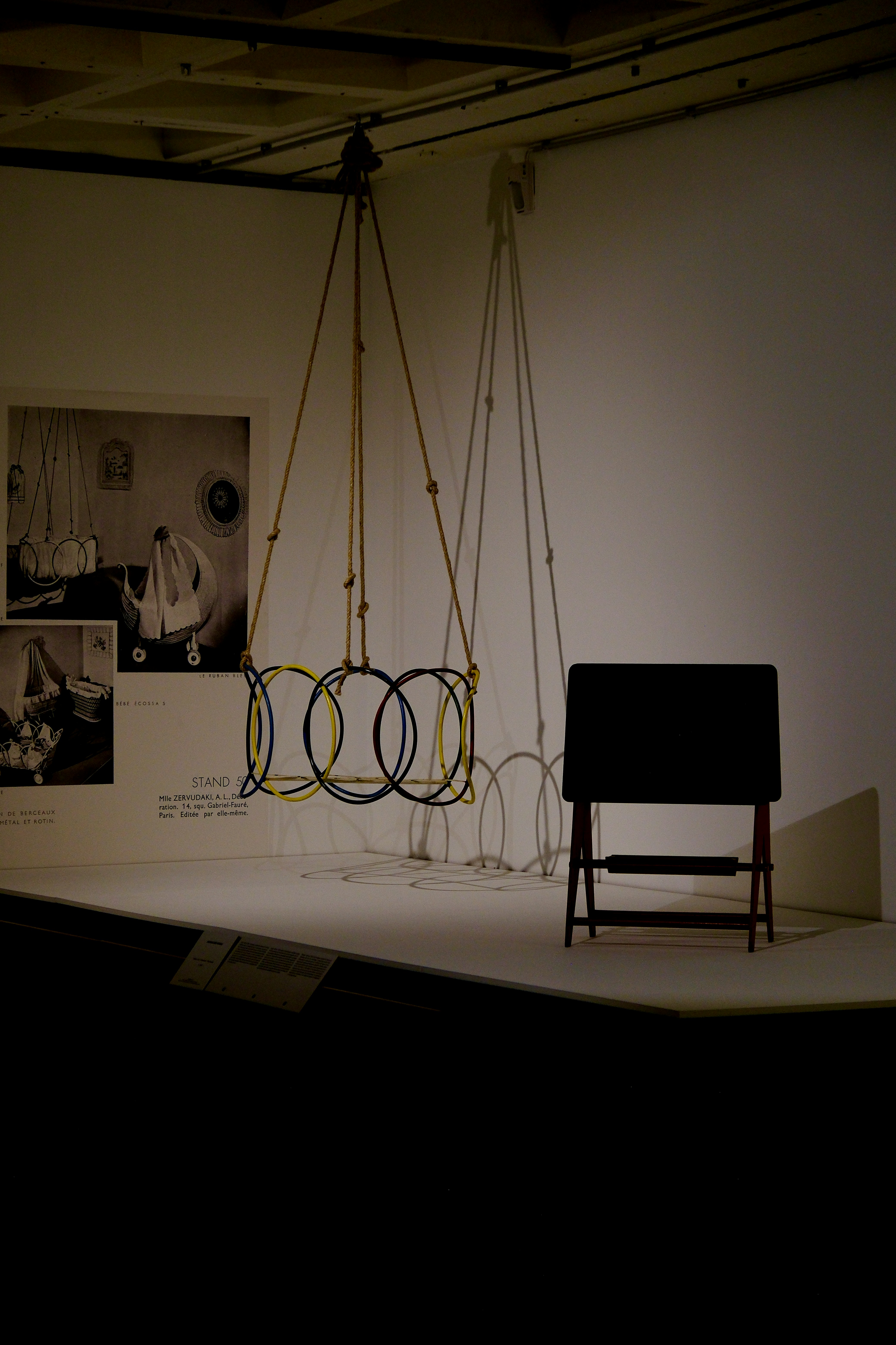 Shadowed Studio Charms: A Loom of Hues and a Quiet Chair