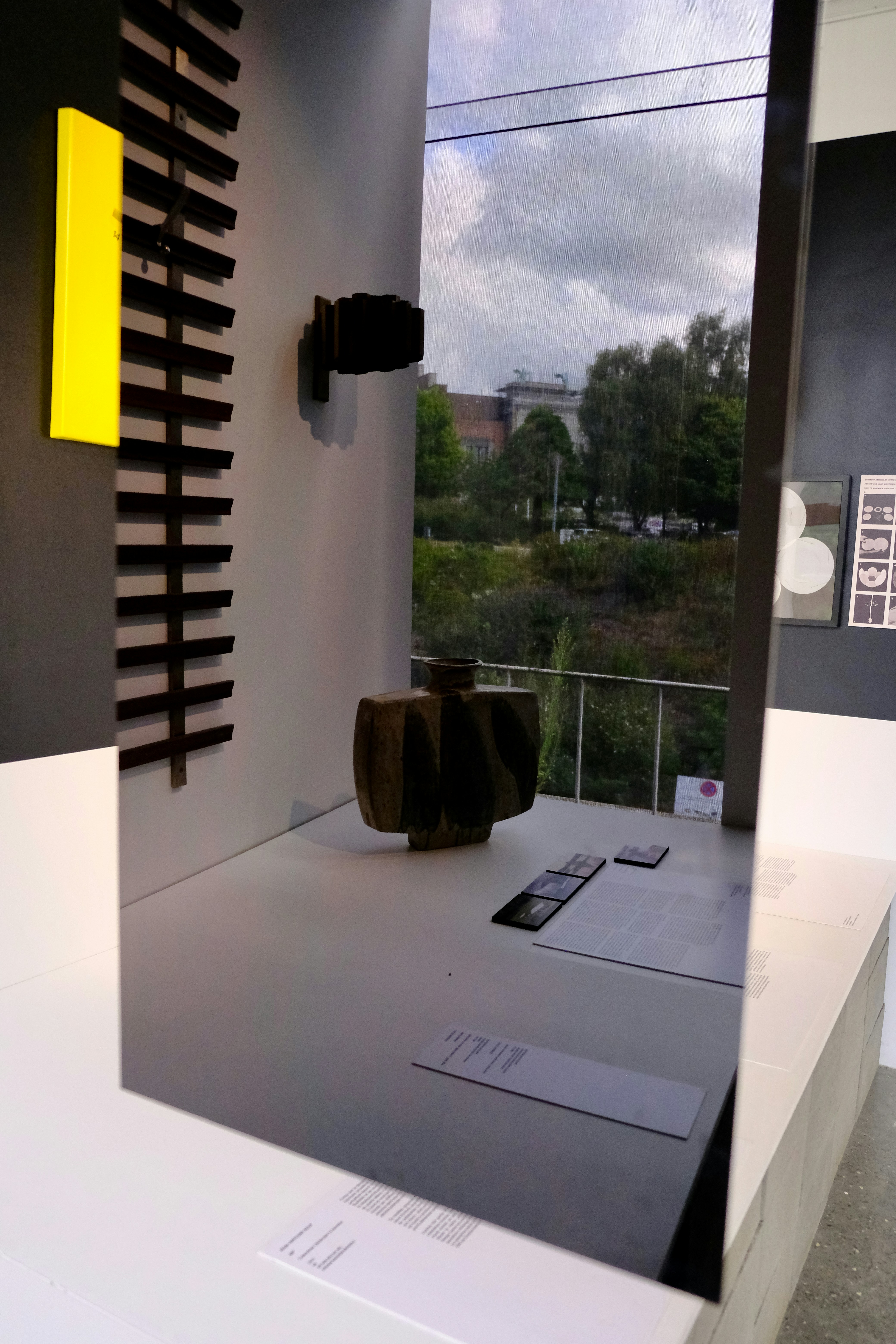 Vertical Exhibition: A Modern Metal Vessel in a Minimal Studio Window