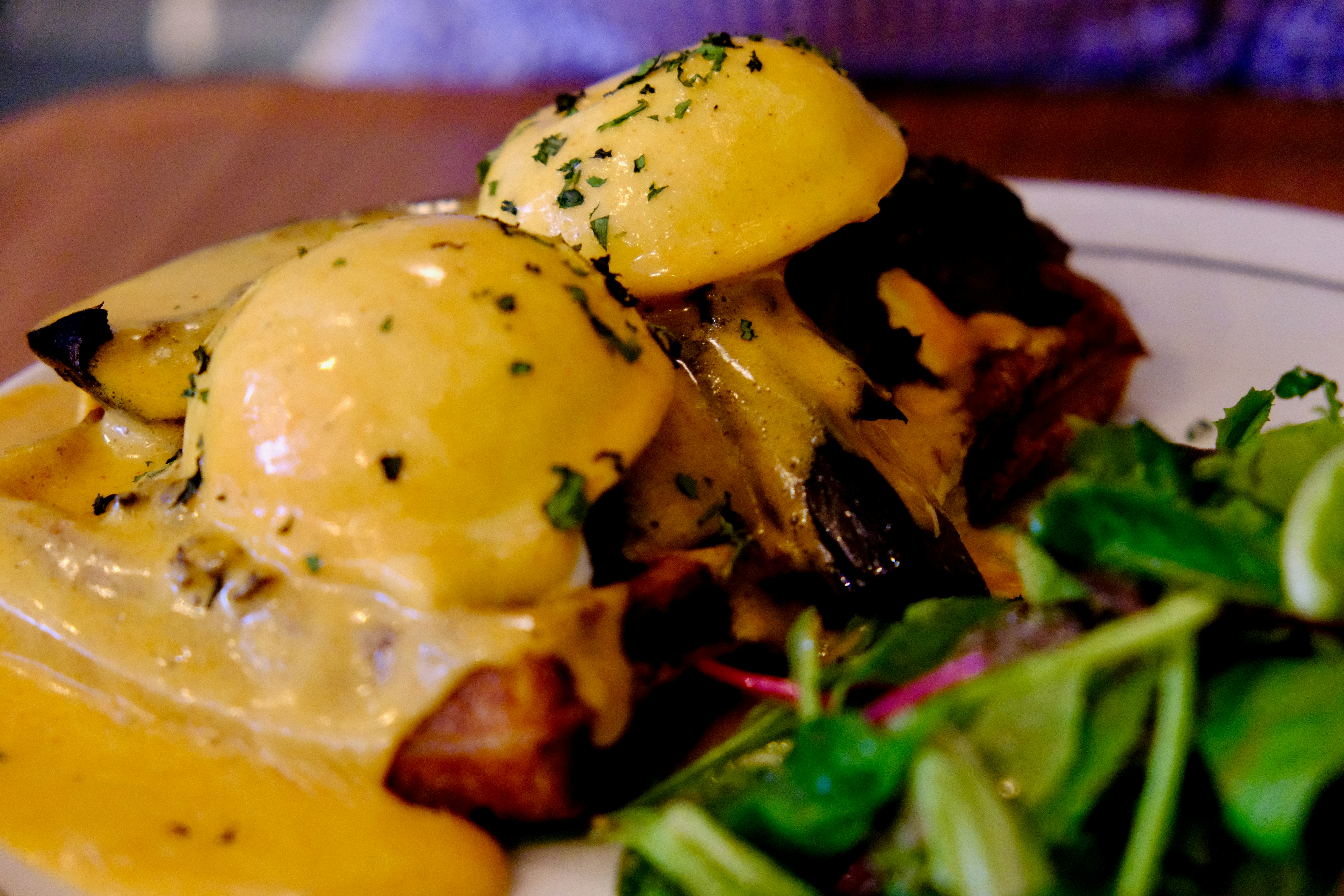 Cheddar-drenched Beef with Eggy Hollandaise Over Toast and Herb Salad