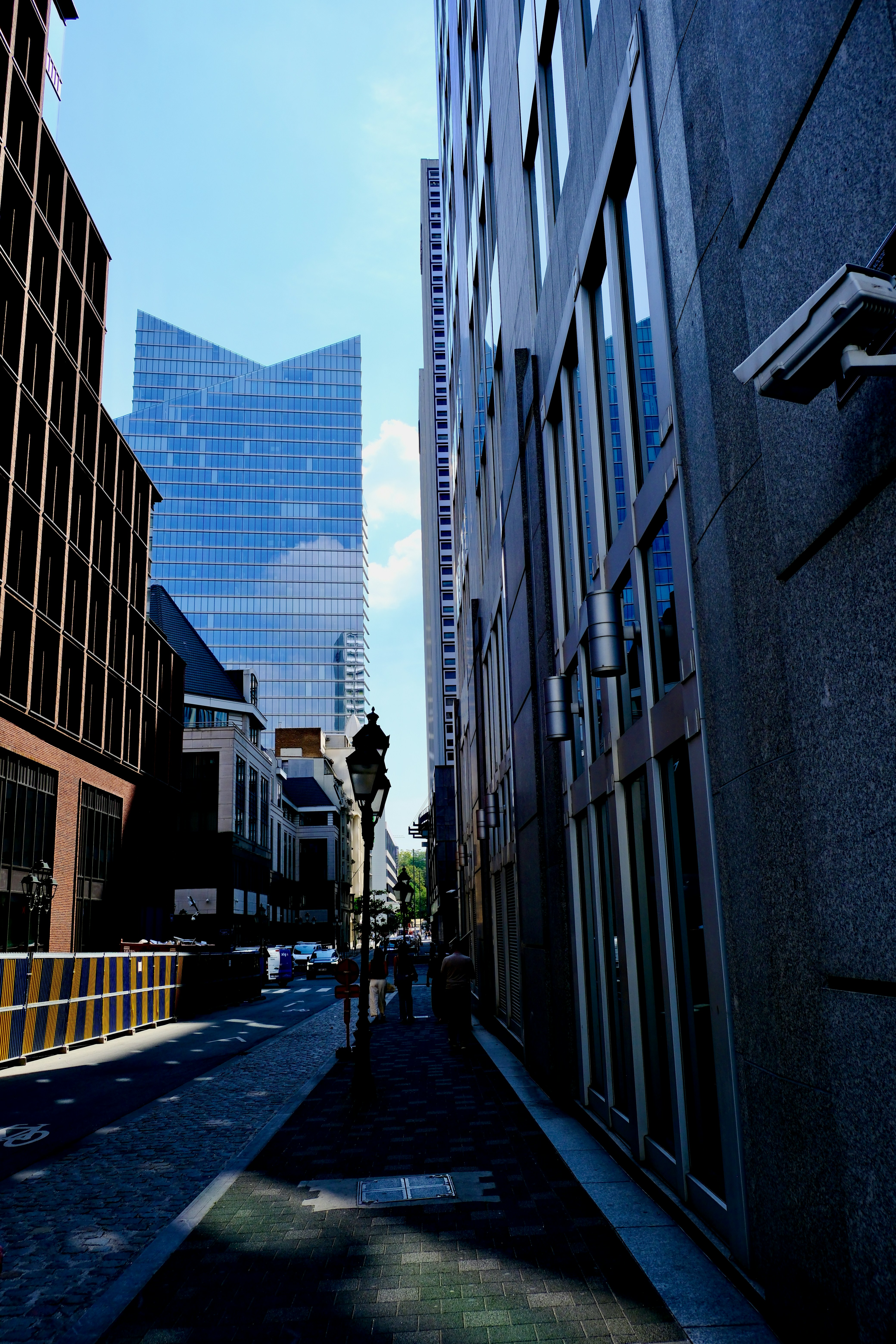 Street Canyon Toward the Glass-Fronted Skyline