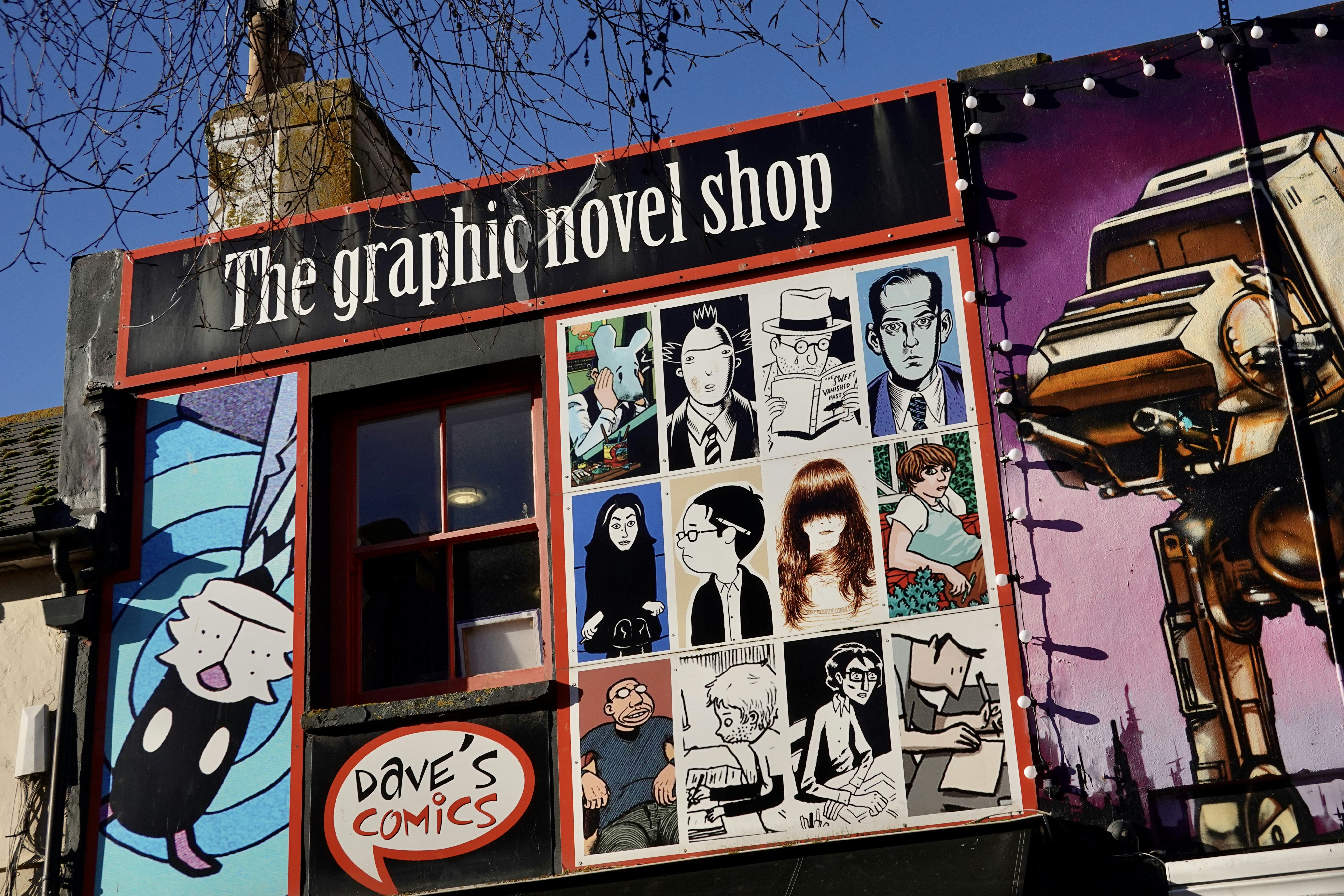 Graphic Novel Wall: A Colorful Corner Store of Comic Frames and Vintage Car