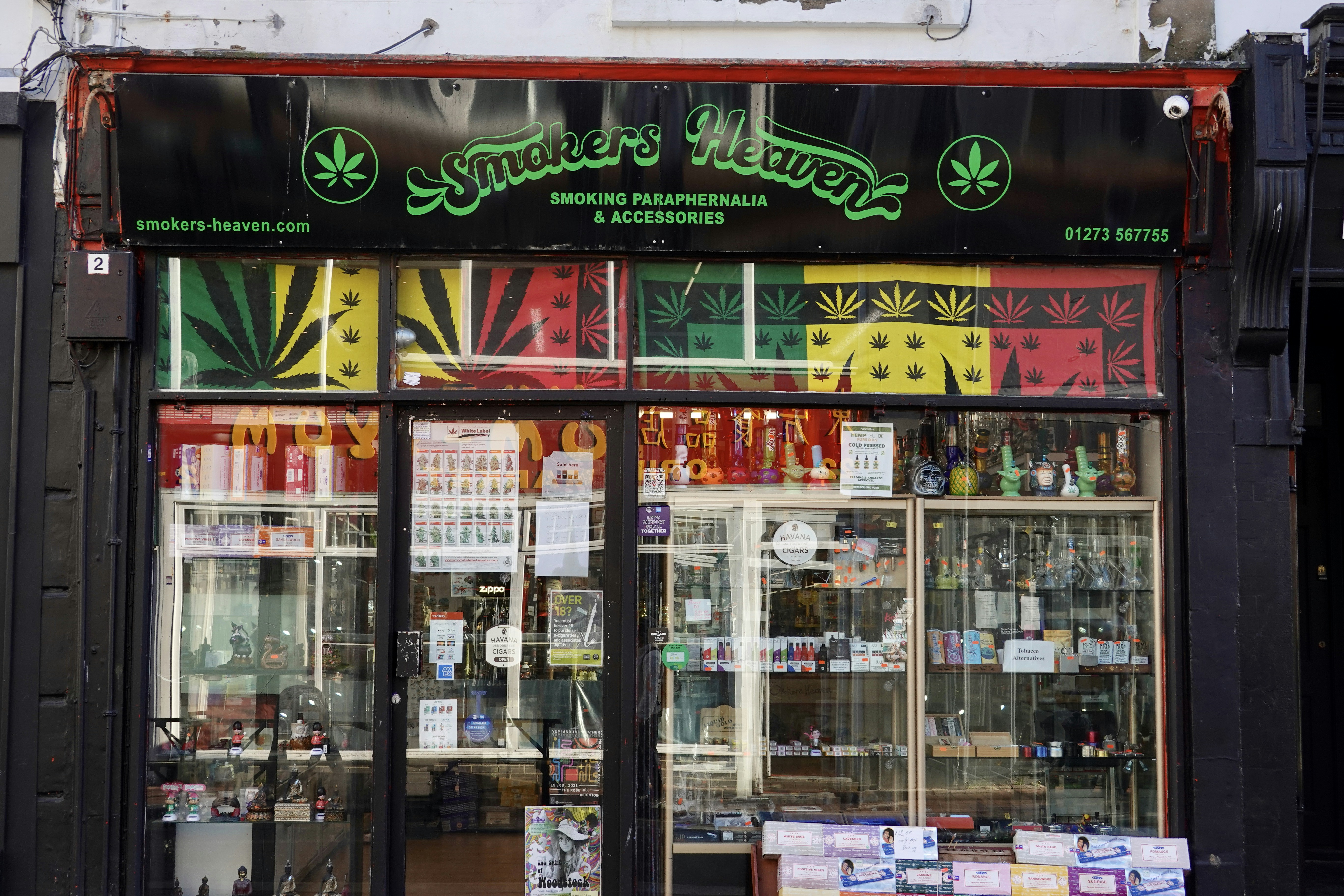 Neon Green Signage Over a Cannabis Paraphernalia Shopfront