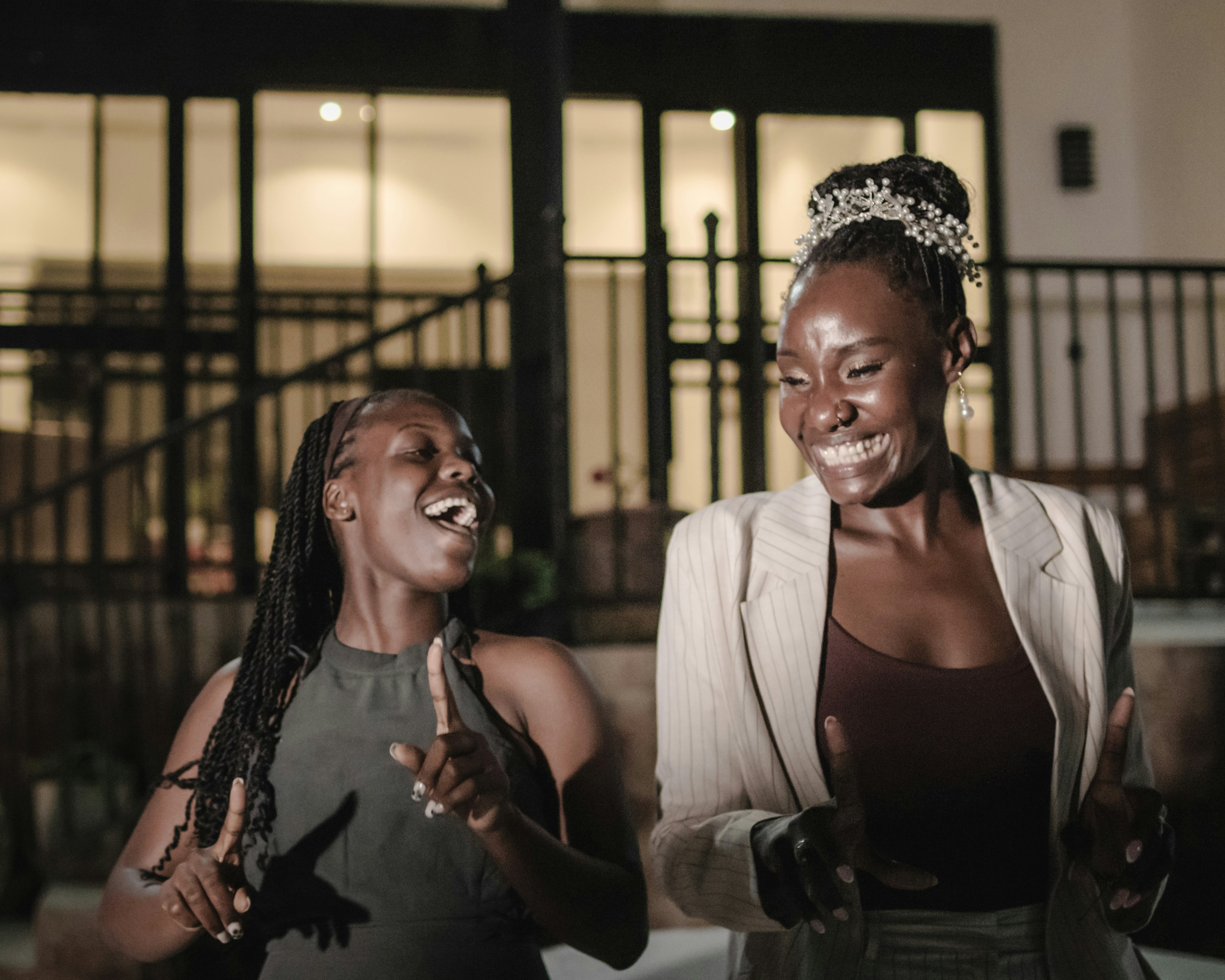 Joyful Duo: Sparks of Laughter Under Night Lights