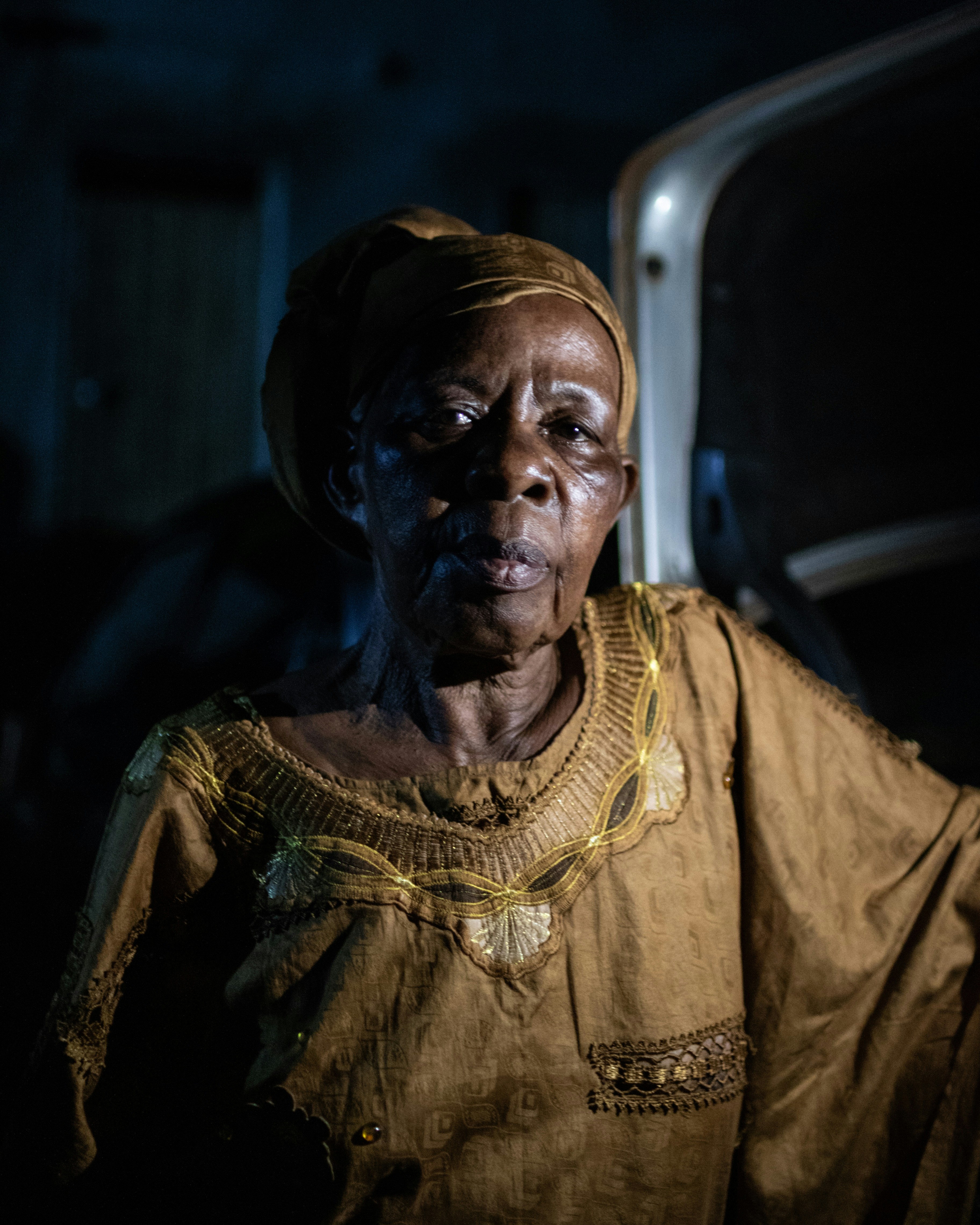Quiet Strength Under Night Sky: Portrait in Dim Light