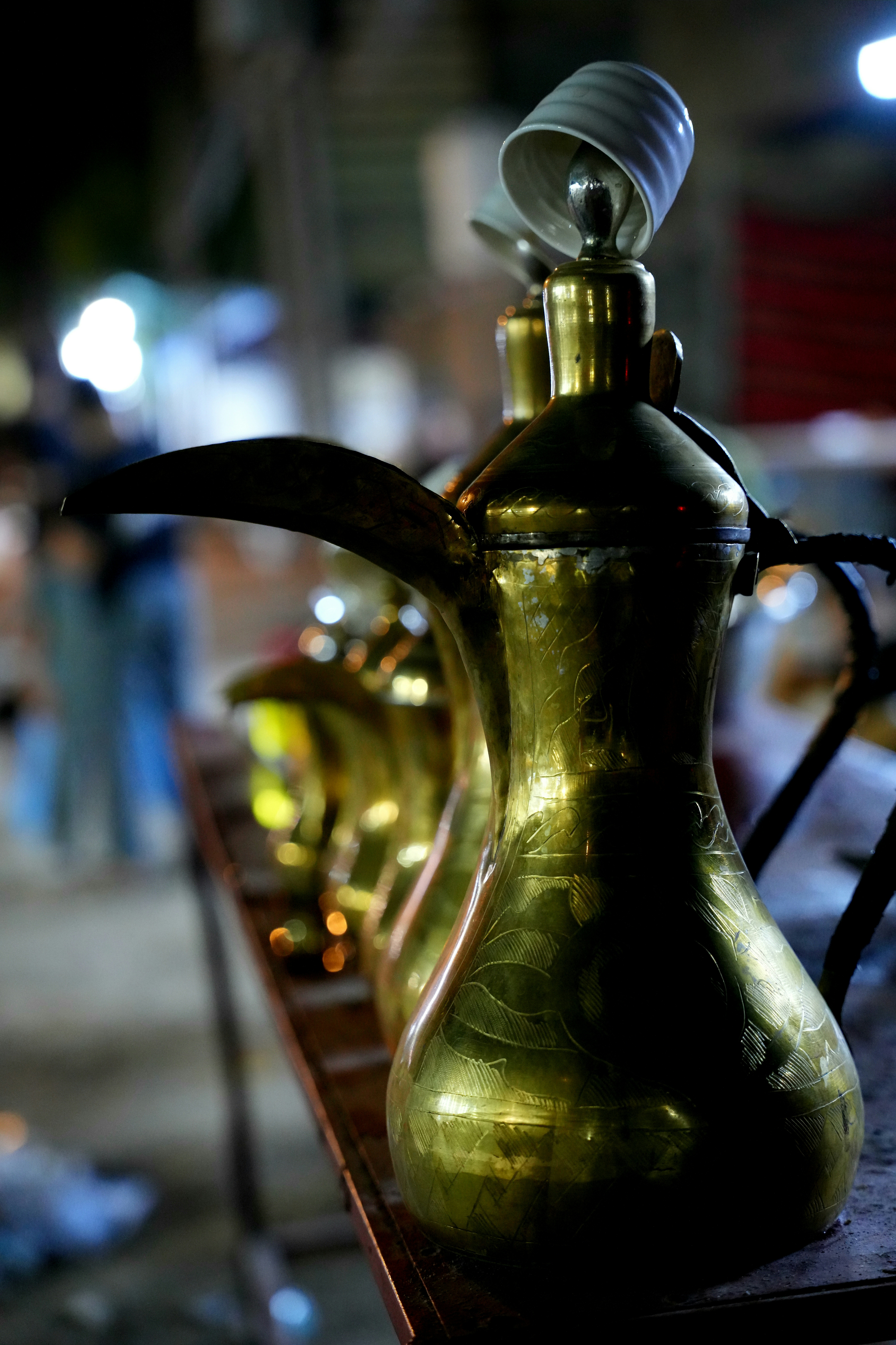 Brass Pour: A Night Market Still Life with Curved Spout