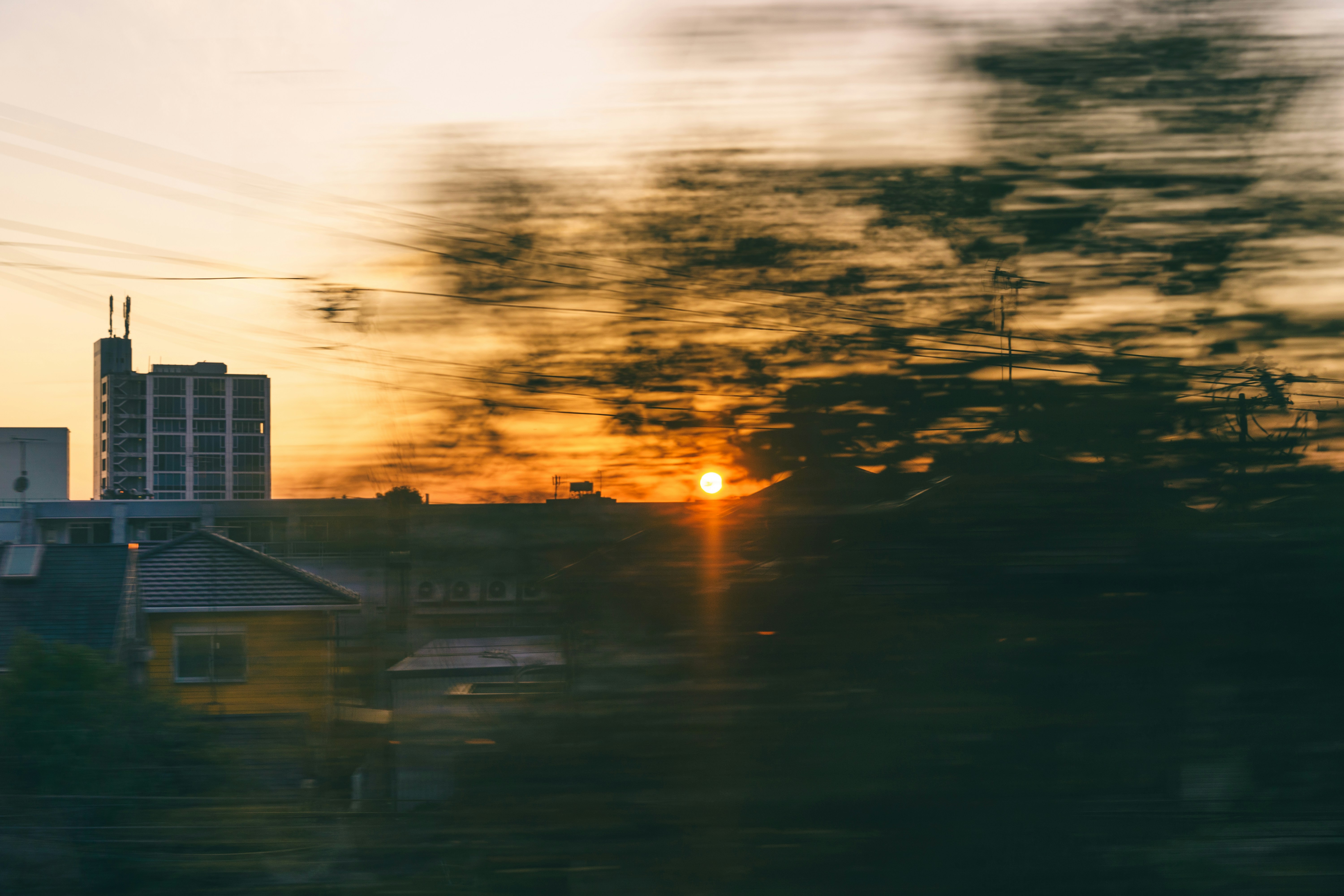 Sunset in Motion: Blurred Skyline with a Glowing Orb
