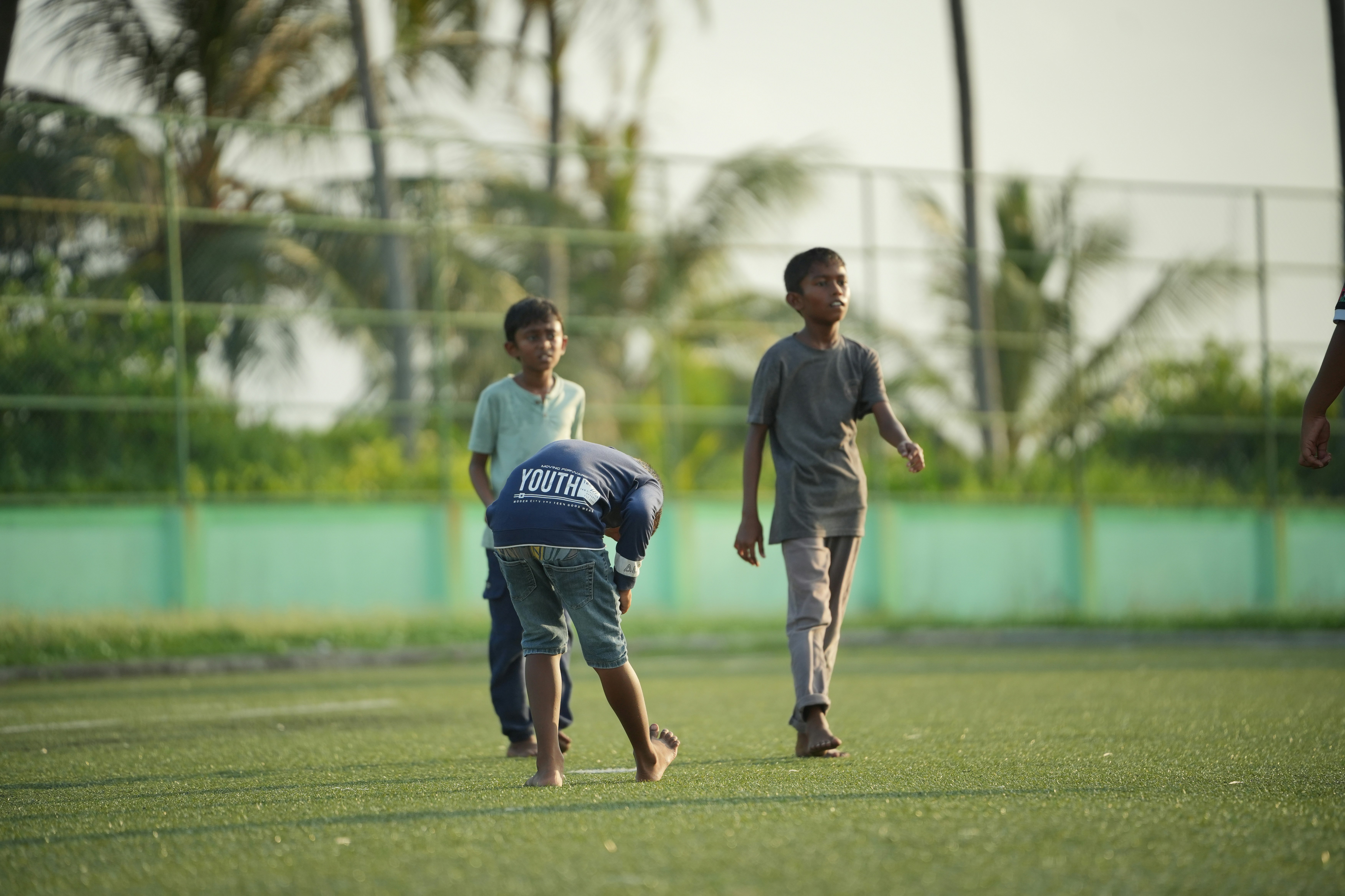Youths at Play: A Moment on the Field