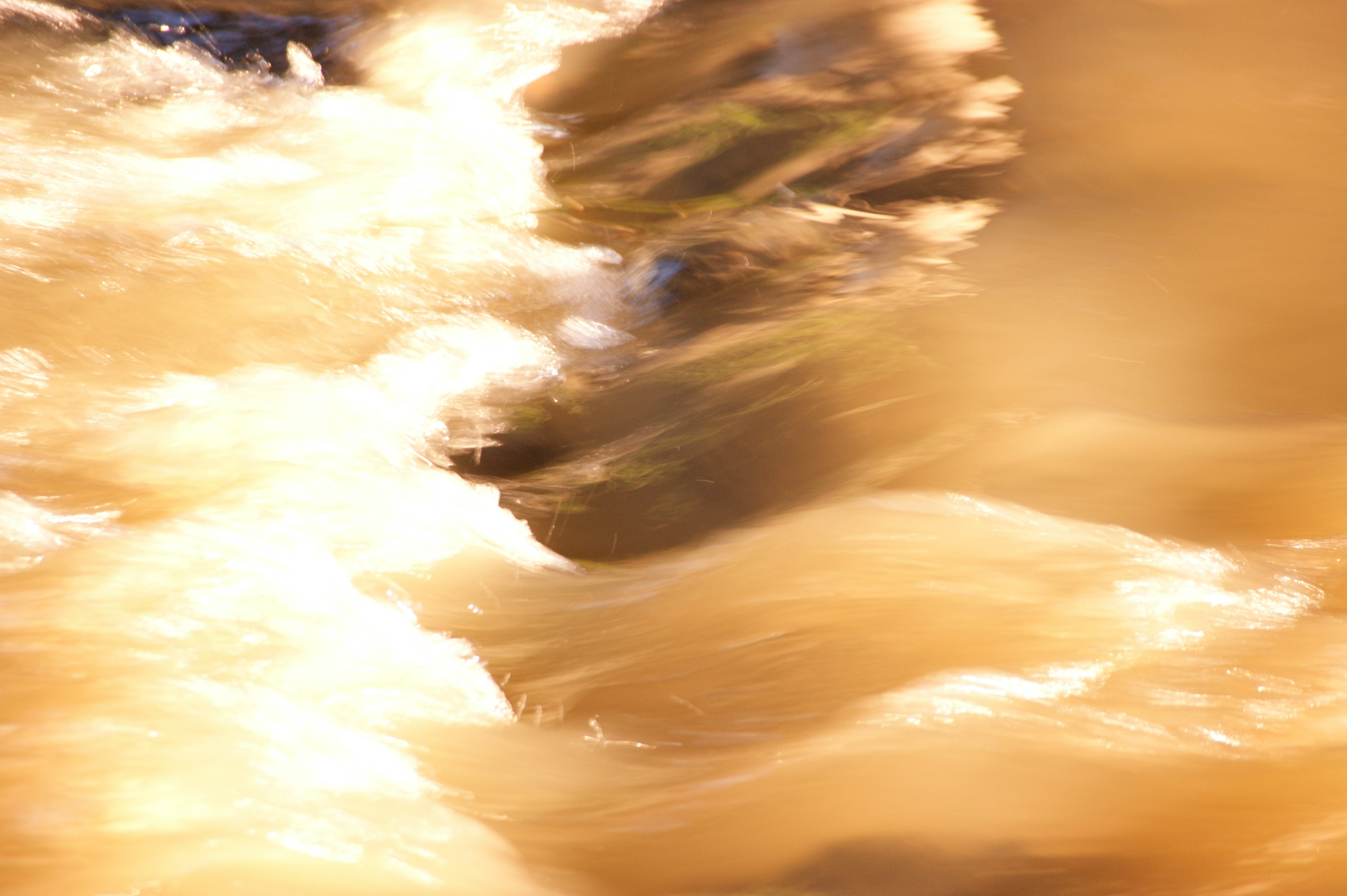 Golden Currents: Abstract Light Through Water