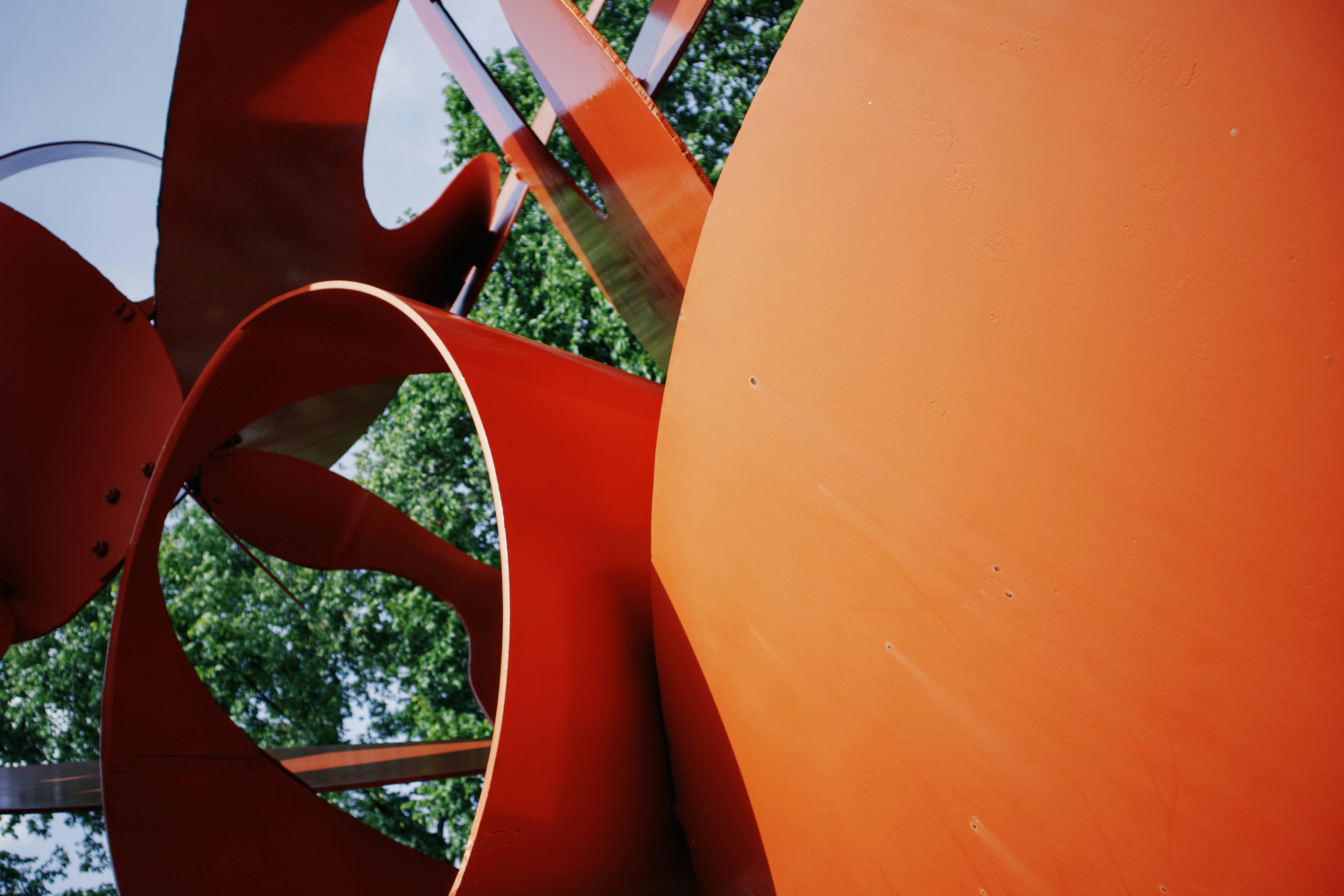 Crimson Curves: Interlocking Slices of Metal and Sky