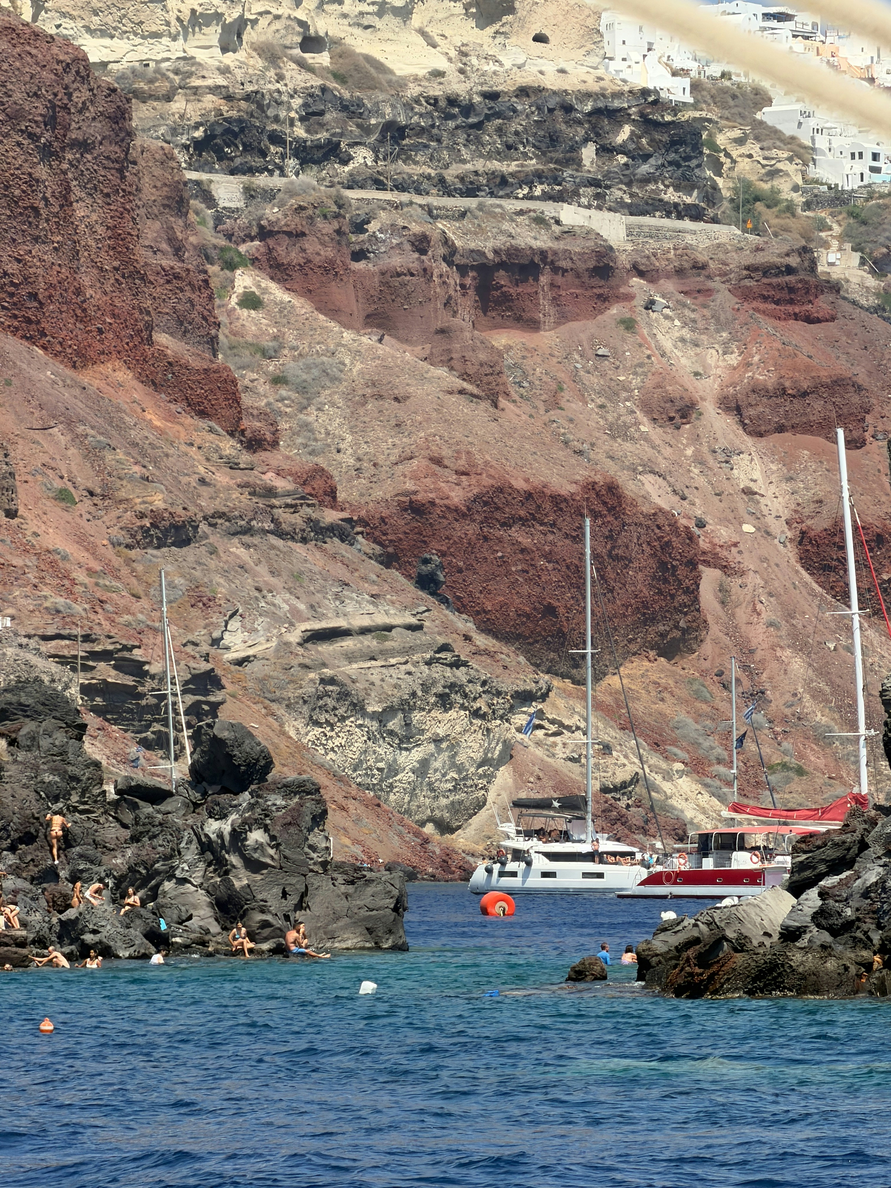 Cliffside Marina: Boats Nestled Against Red Rock Walls