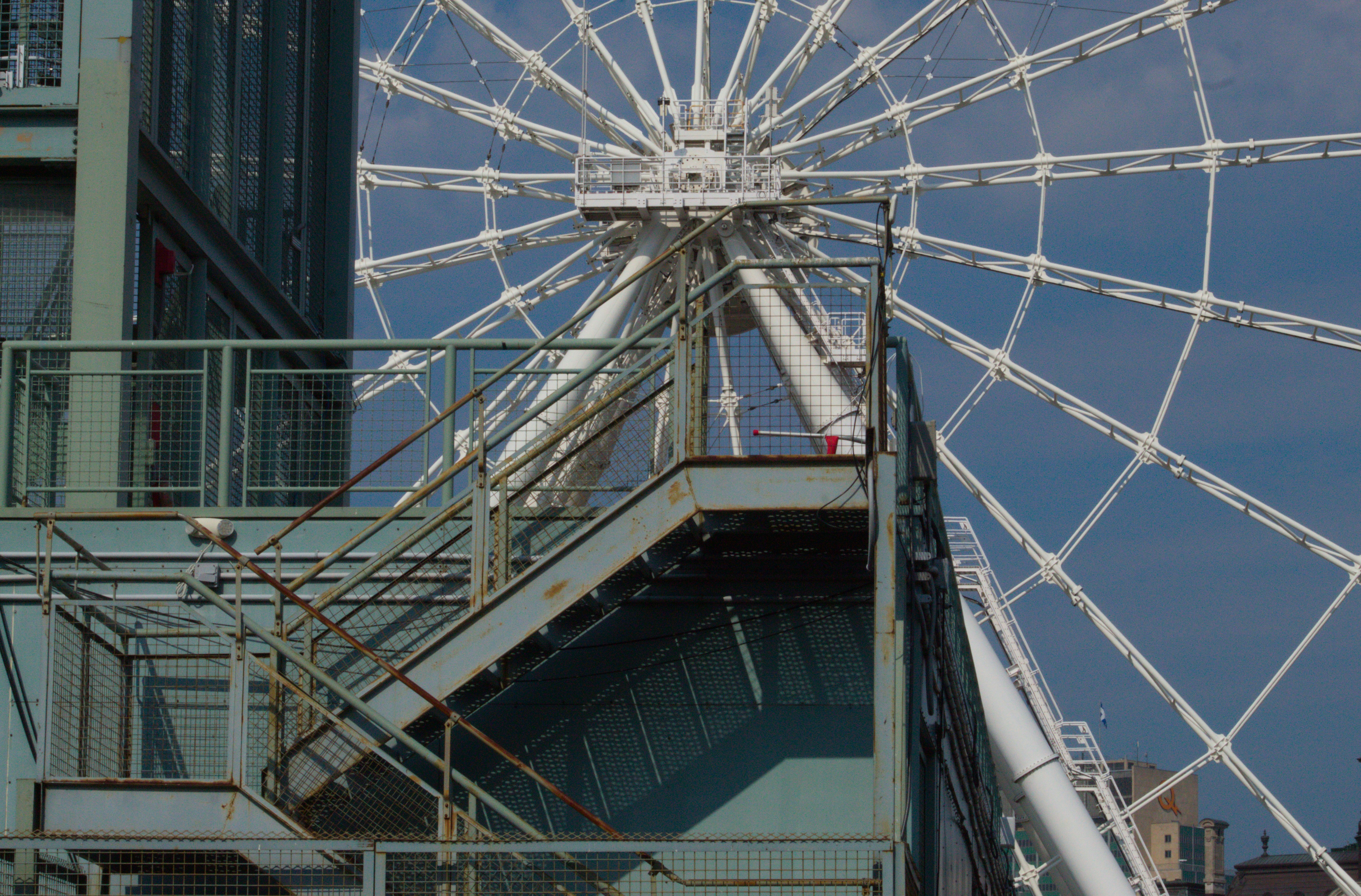 Ferris Wheel Silhouette Over Steel Staircase