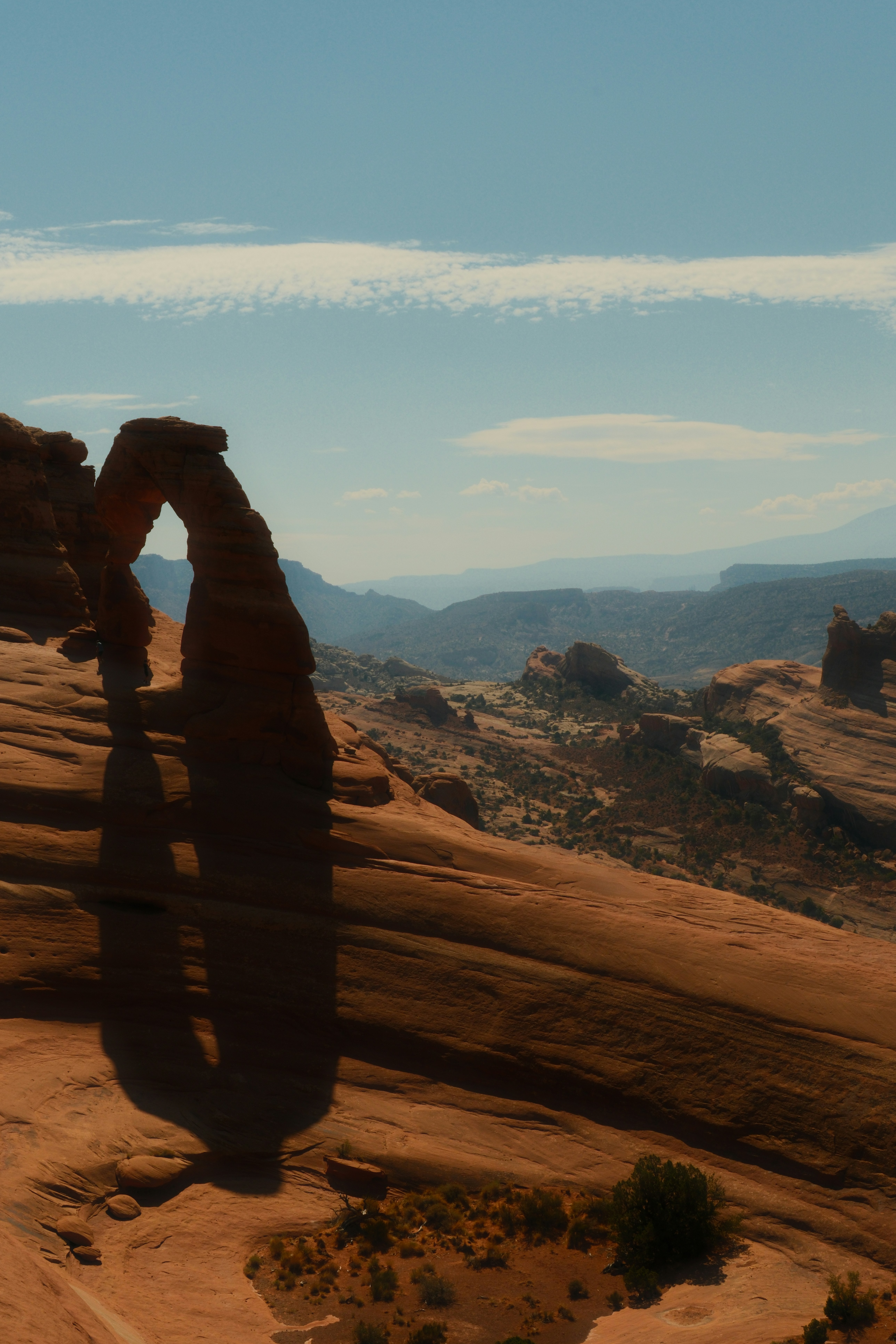 Natural Stone Arch Shadows Amid Desert Horizons