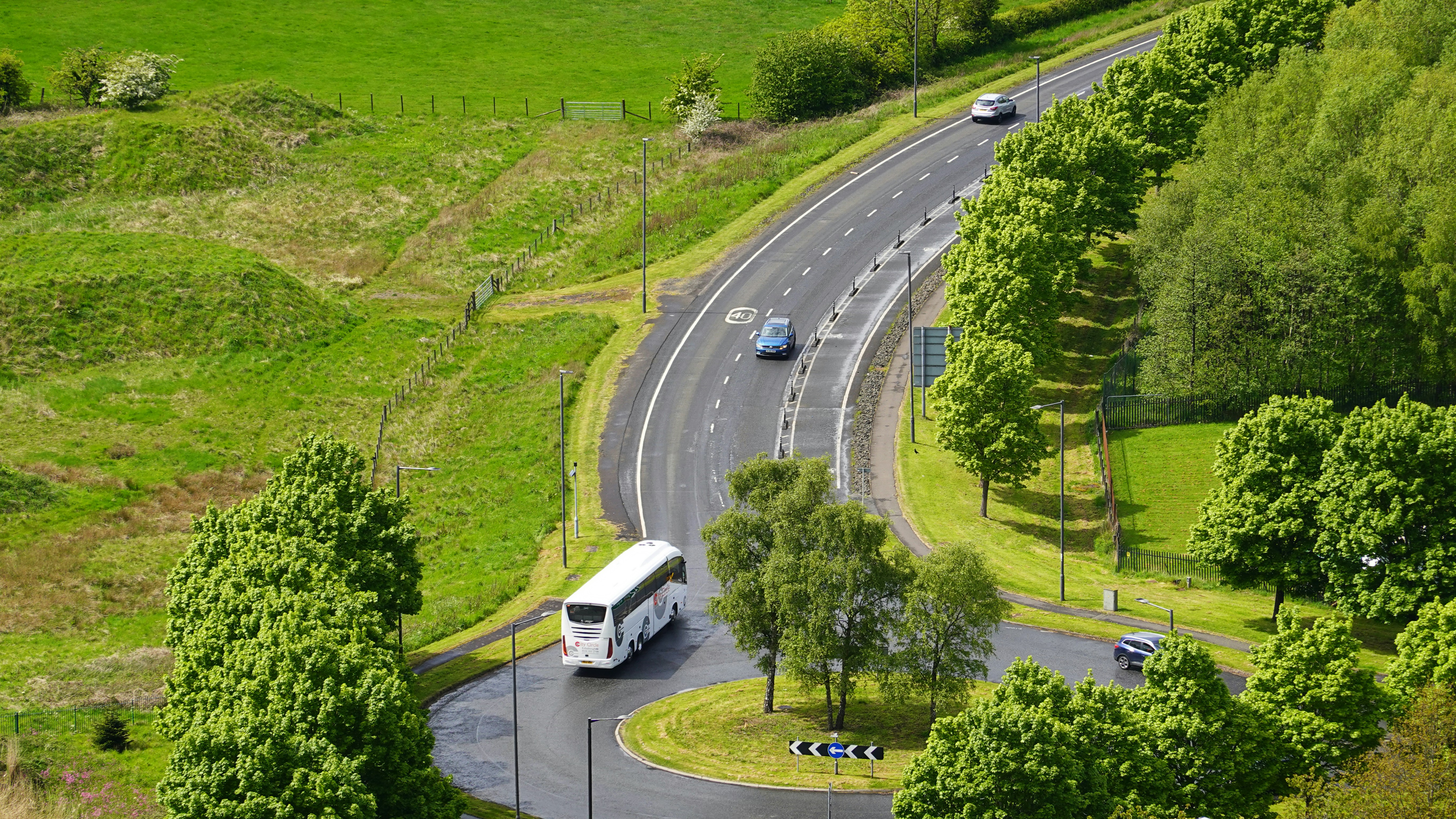 Curving Highway Through a Lush Green Corridor