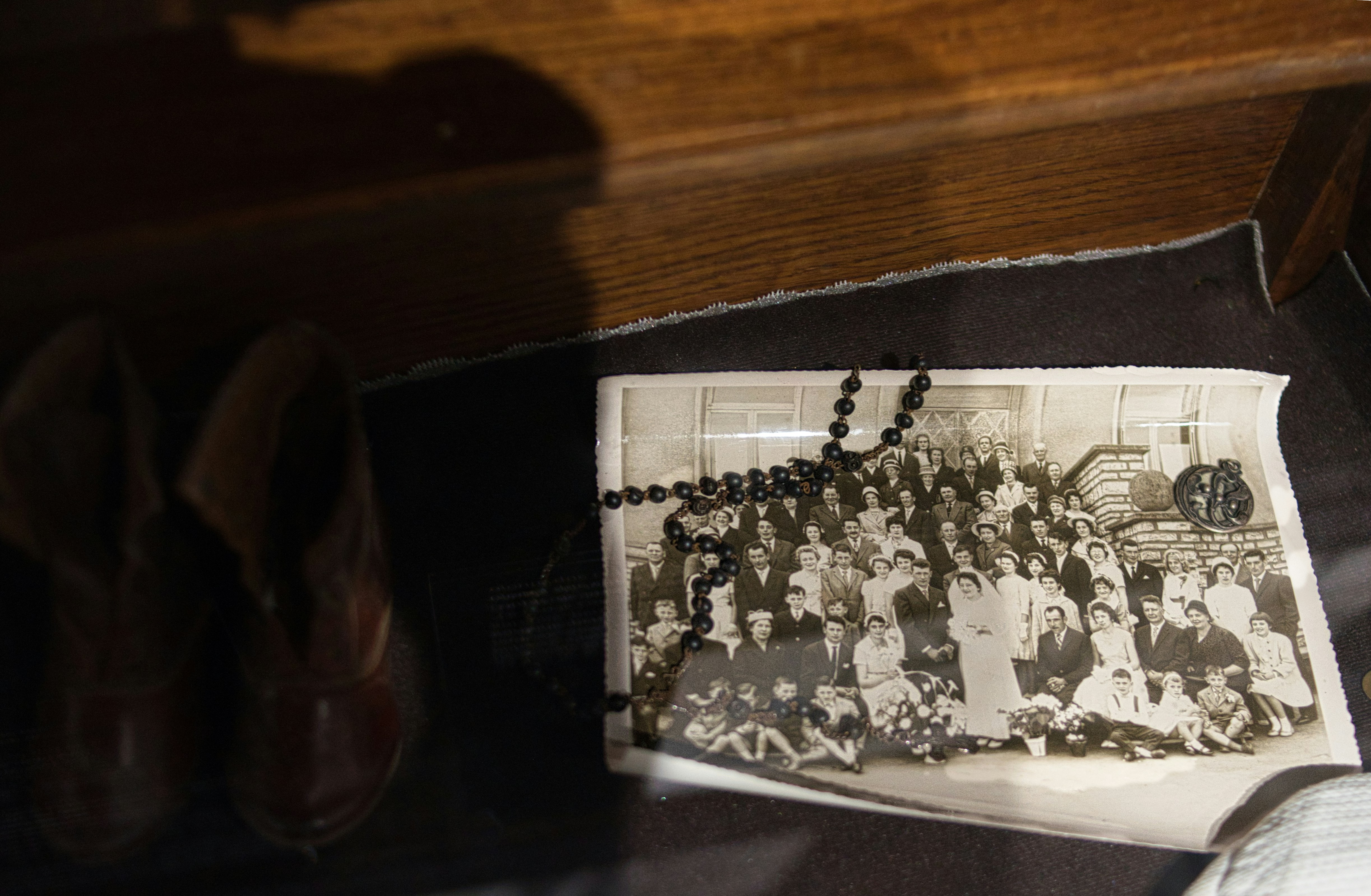 Whispers of a Past: A Framed Moment Beneath a Beaded Garland