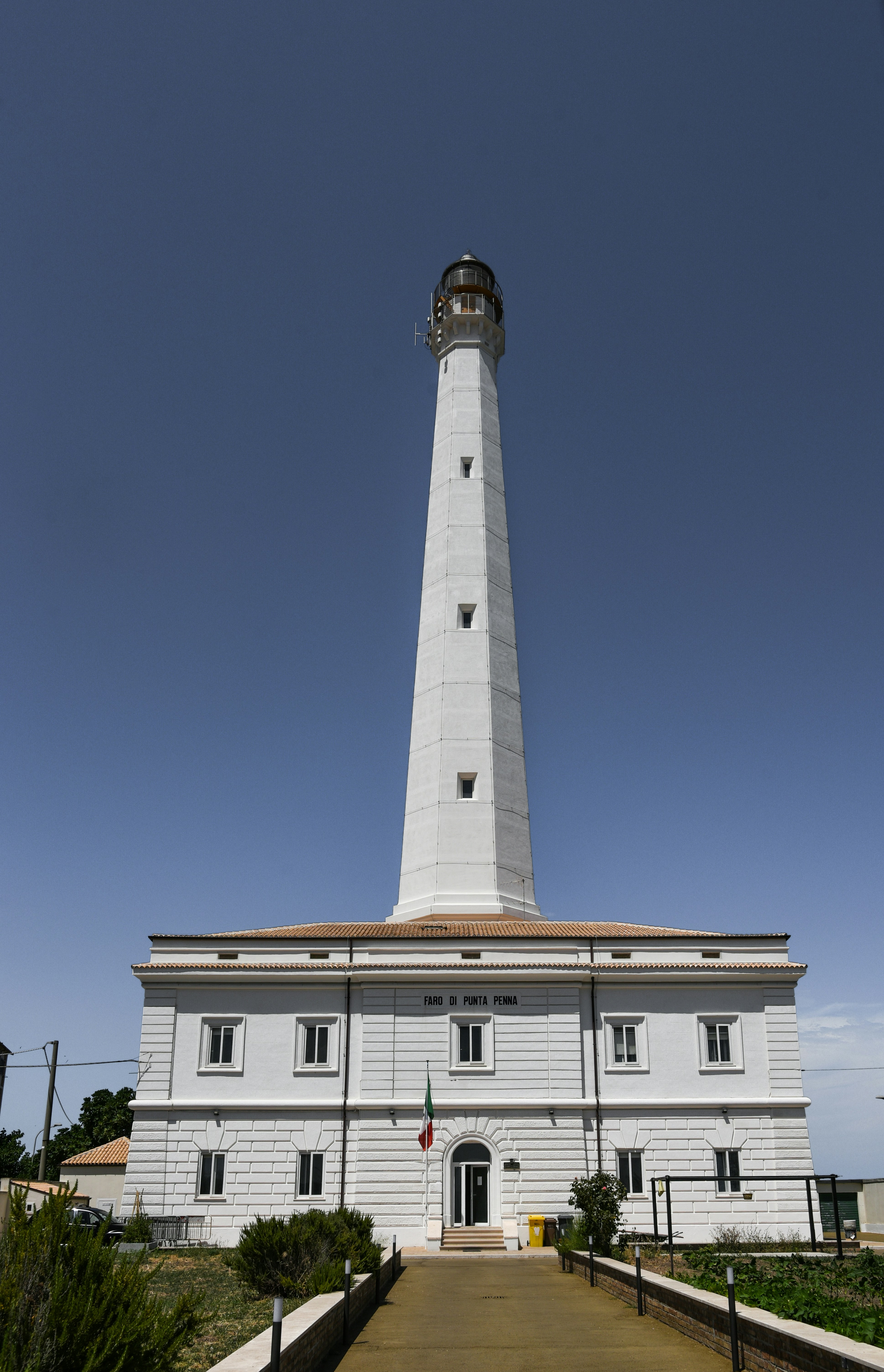 Lighthouse Crowned by Sky: A Coastal Beacon Stands Tall