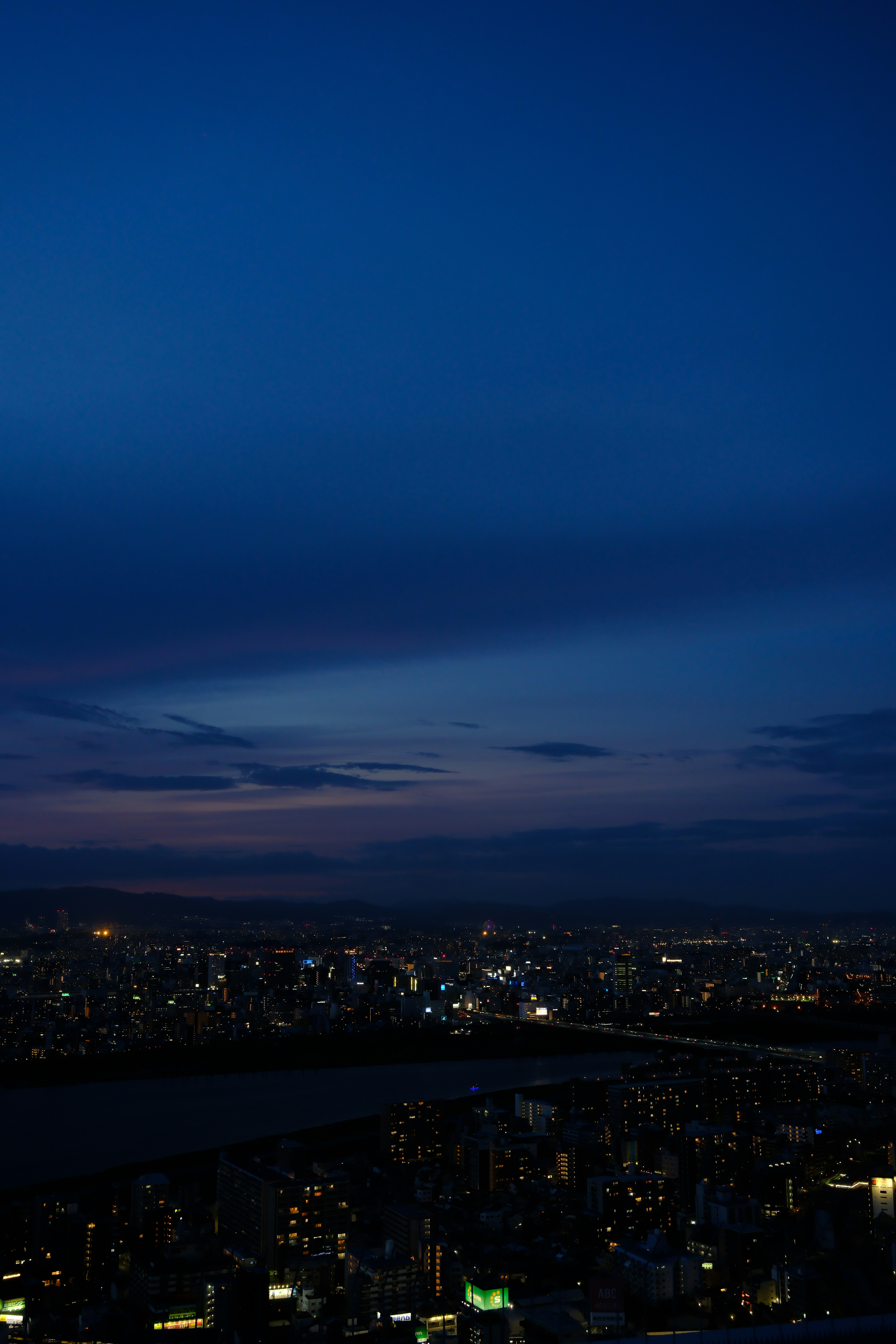 Midnight River Lights: A Quiet City Breathing Under A Deep Blue Sky