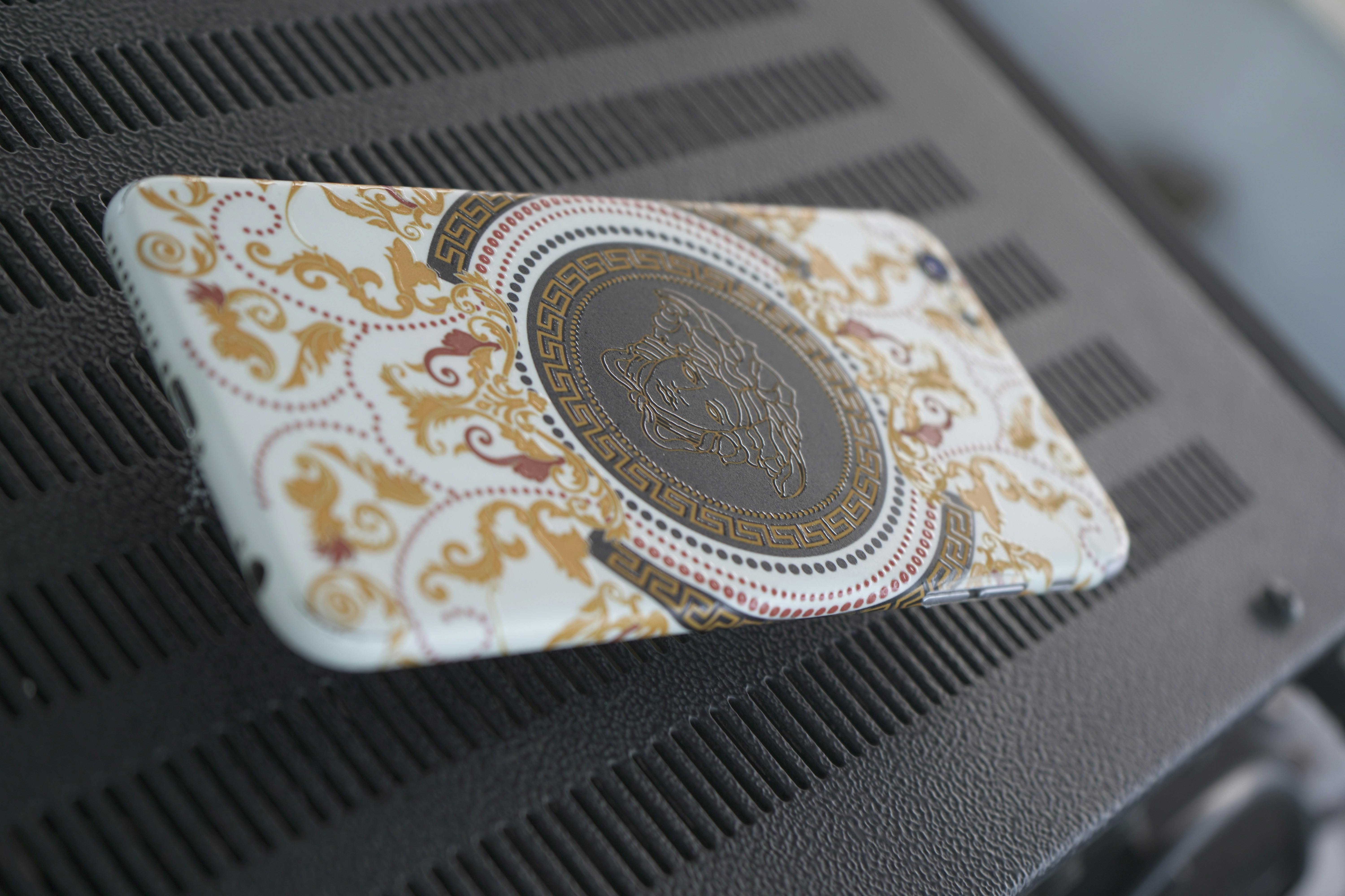 Ornate card resting on textured surface with subtle tilt