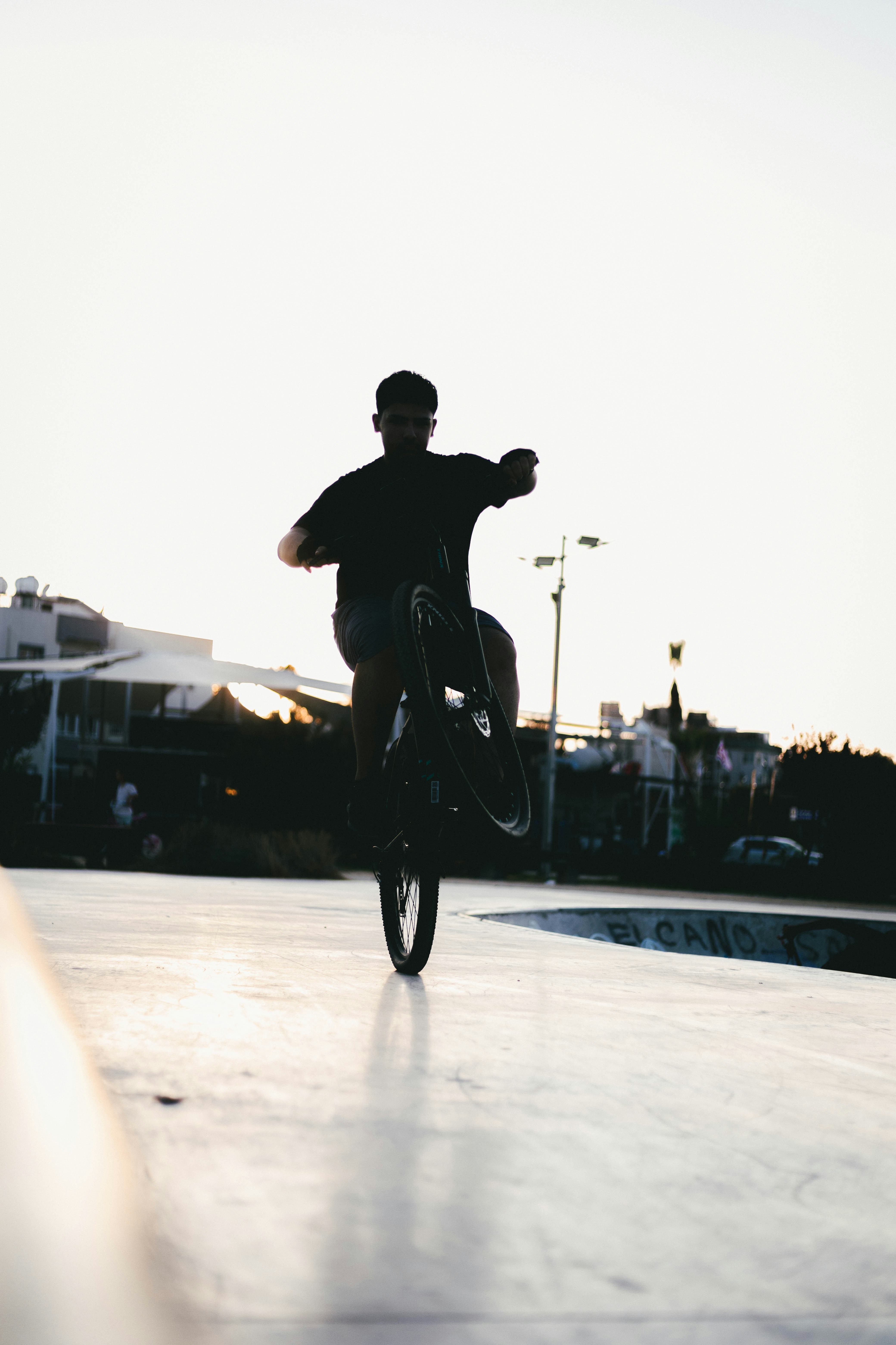Mid-air Moment: Rider Lifts Off at Sunset Skate Deck