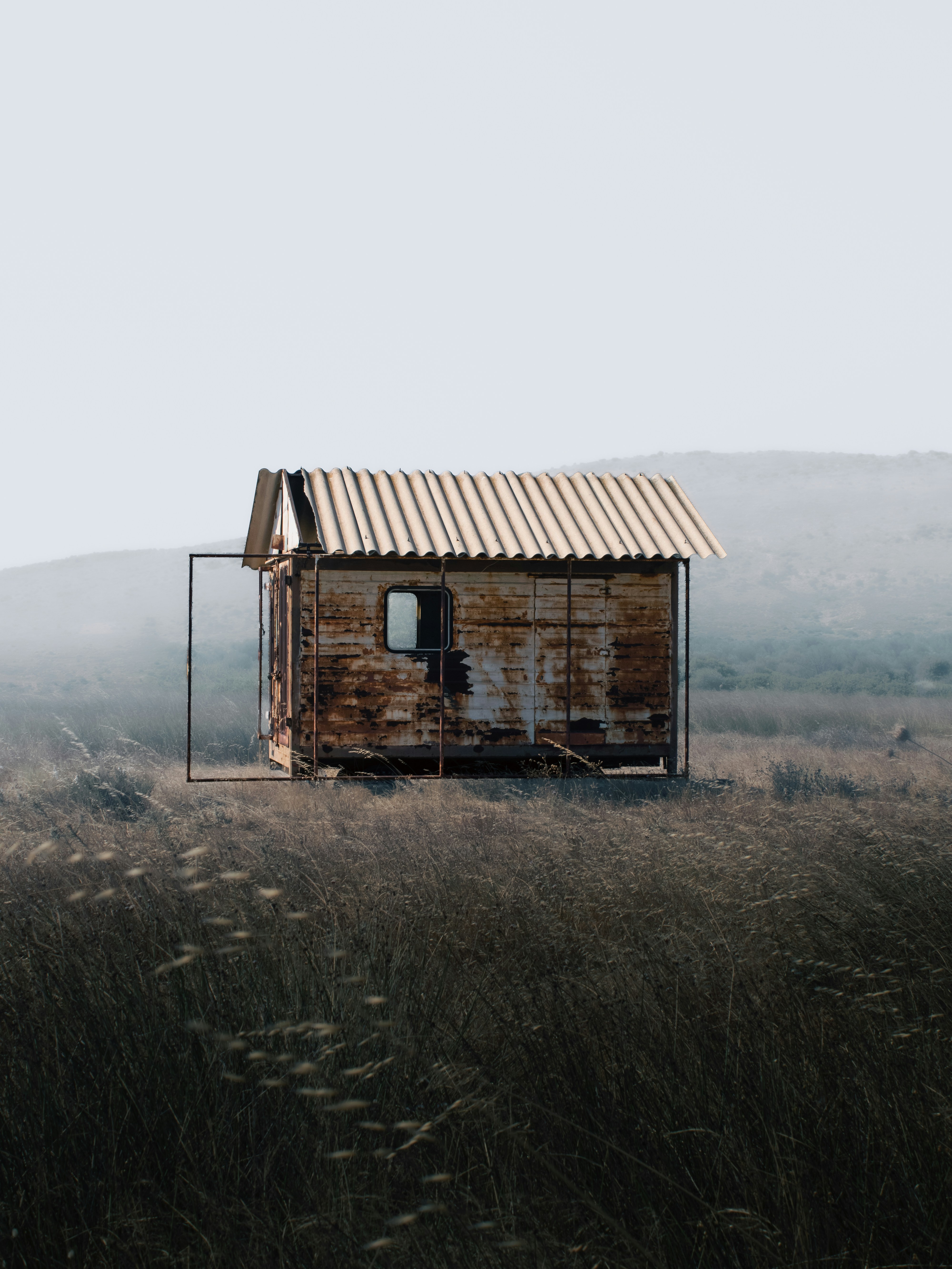 Rust on the Wind: A Lone Shack in a Distant Prairie
