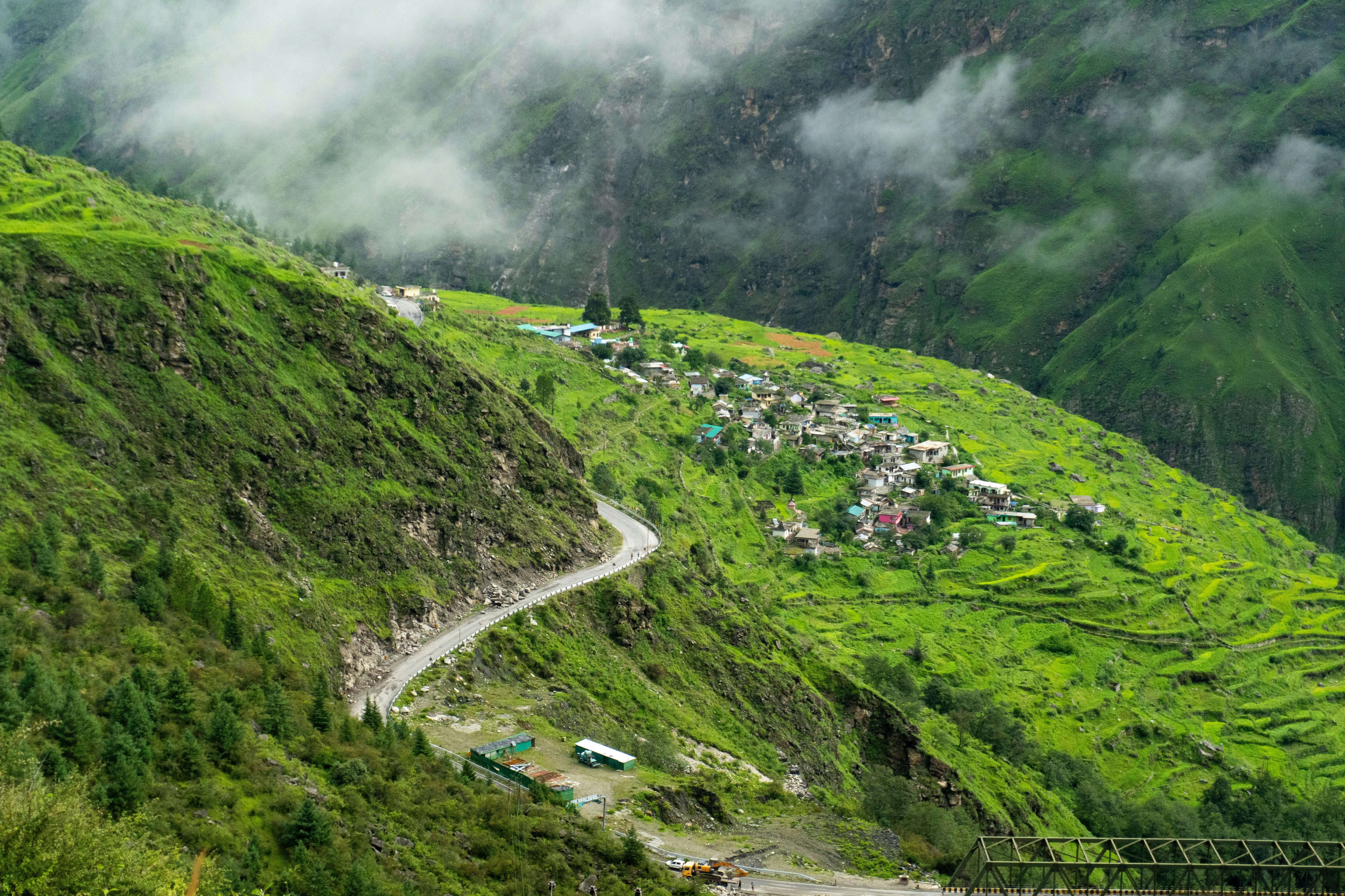 Terraced Village Clinging to a Green Ribboned Ridge