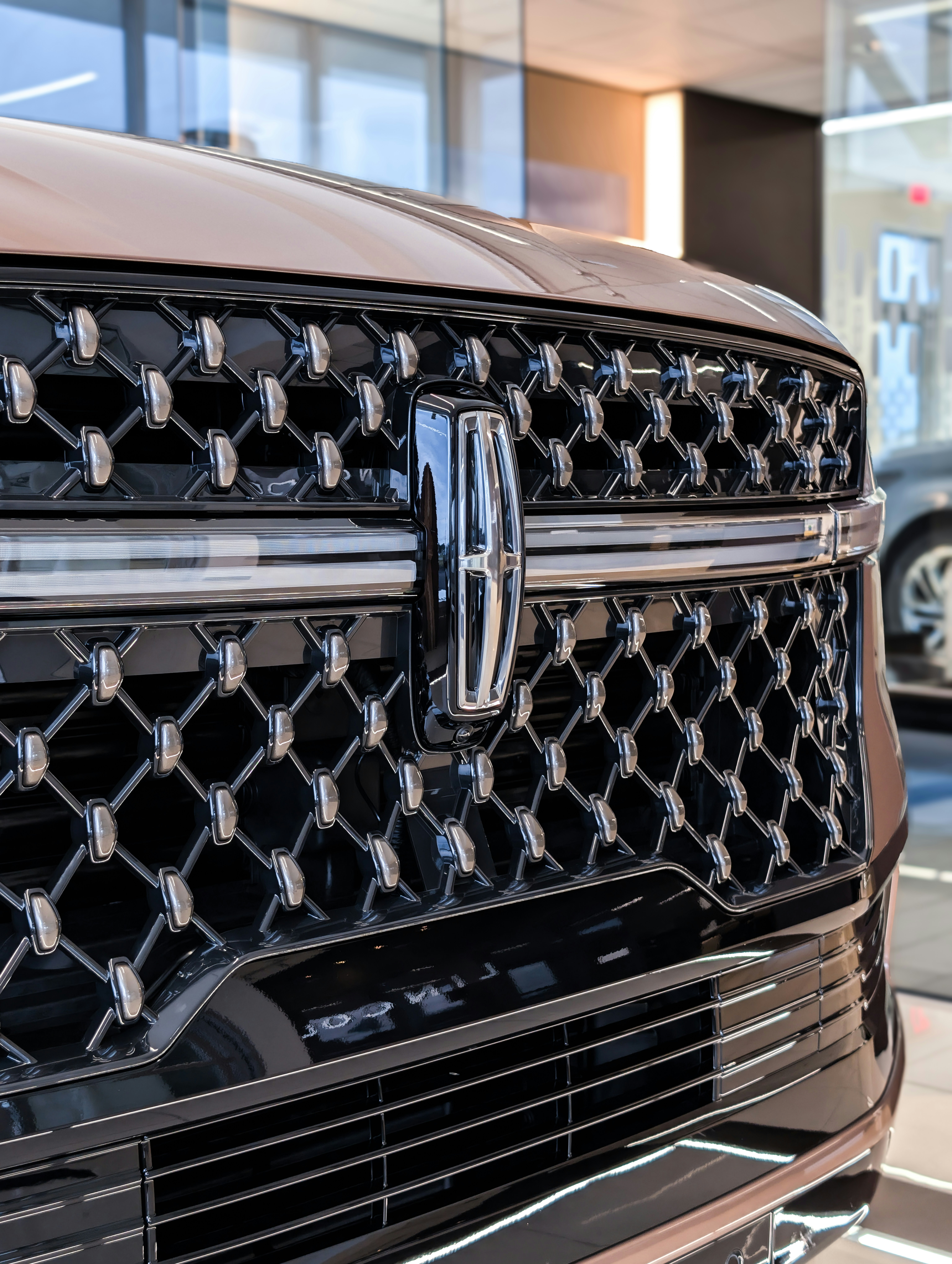 Chrome Grille Symphony: A Close-Up of the Iconic Vehicle Emblem