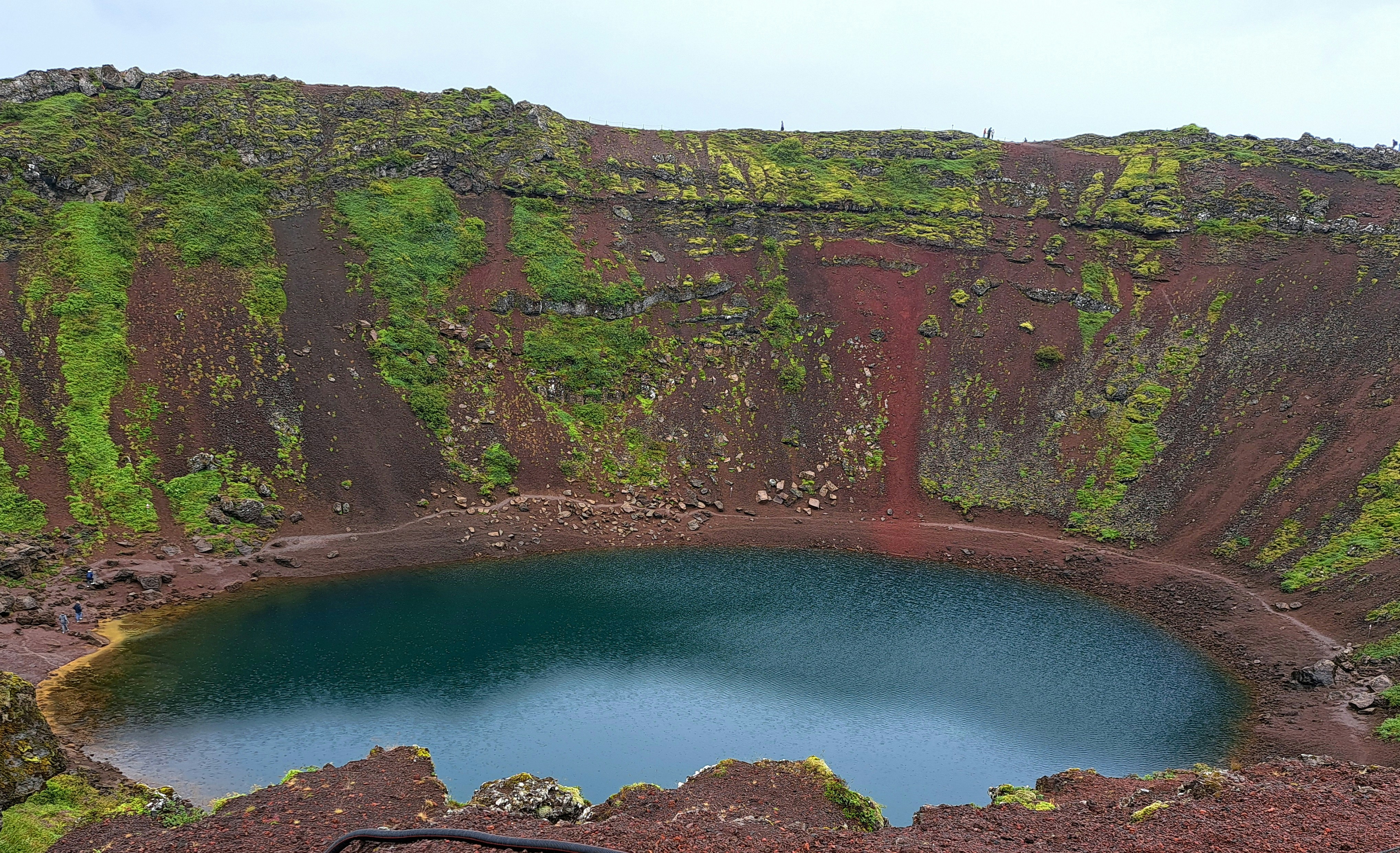 Emerald Rim: A Quiet Green Caldera Harboring Blue Silence