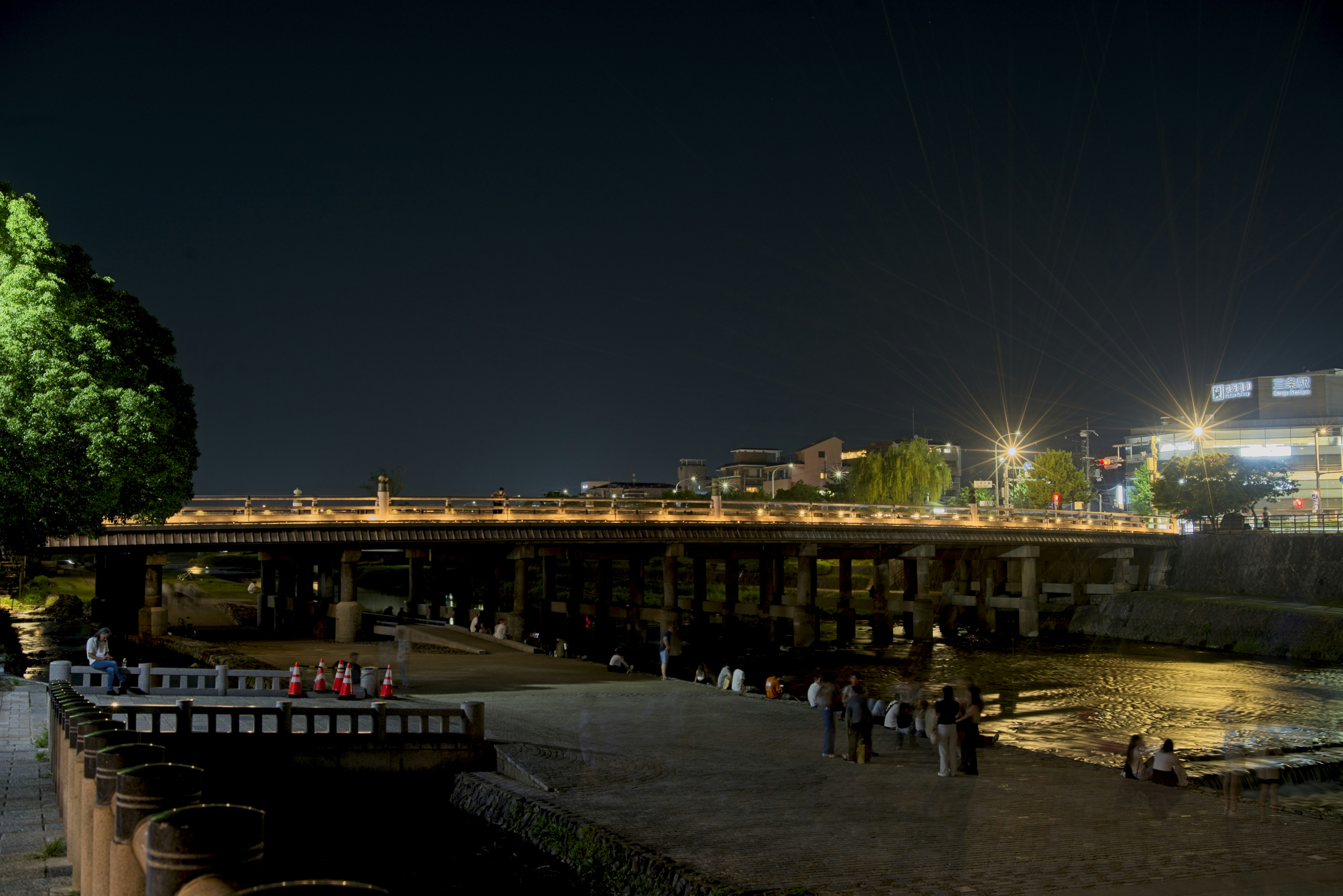 Evening Lights on the Quiet Riverfront Bridge