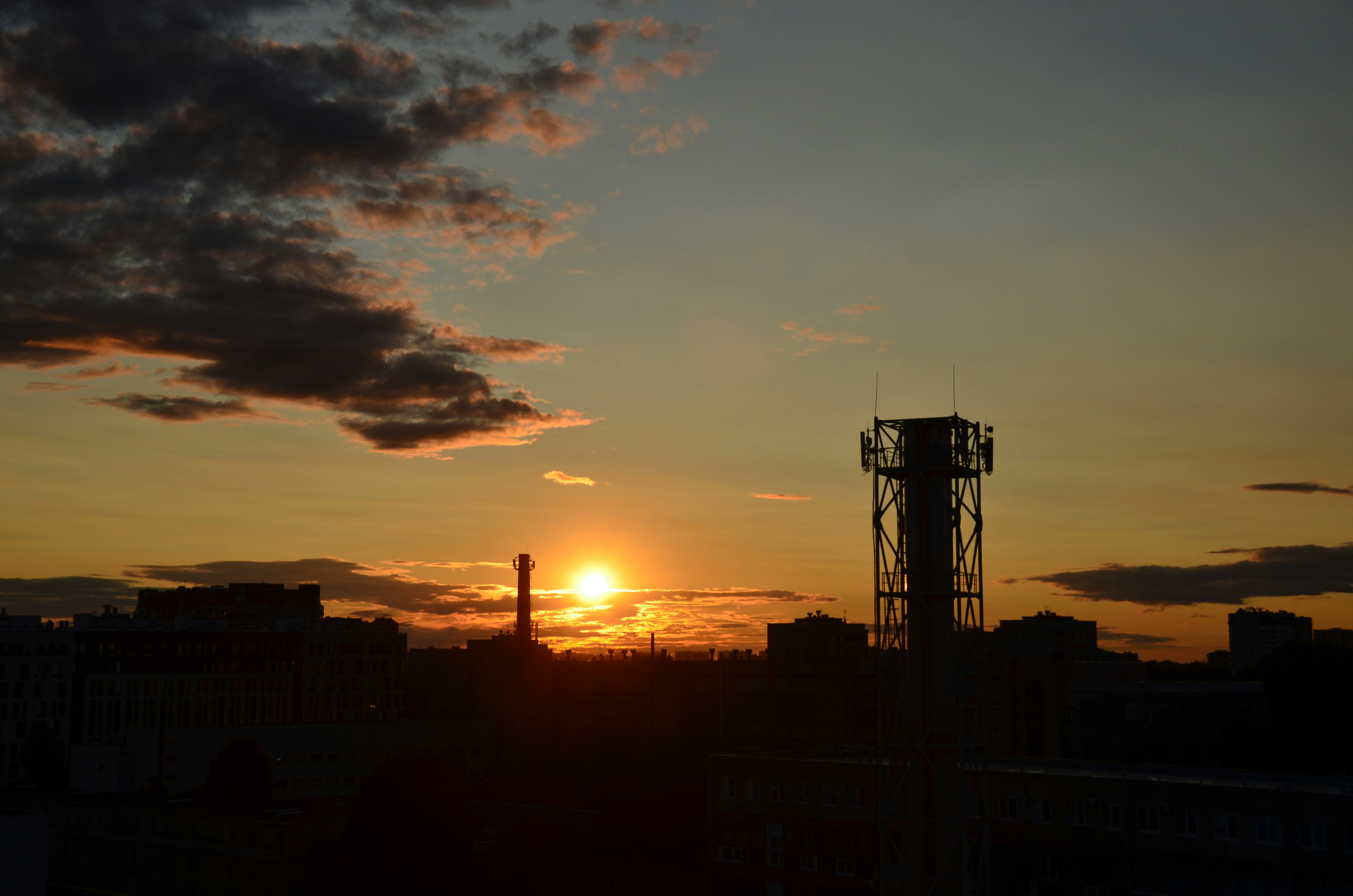 Sunset Silhouette Over a Quiet Urban Ridge