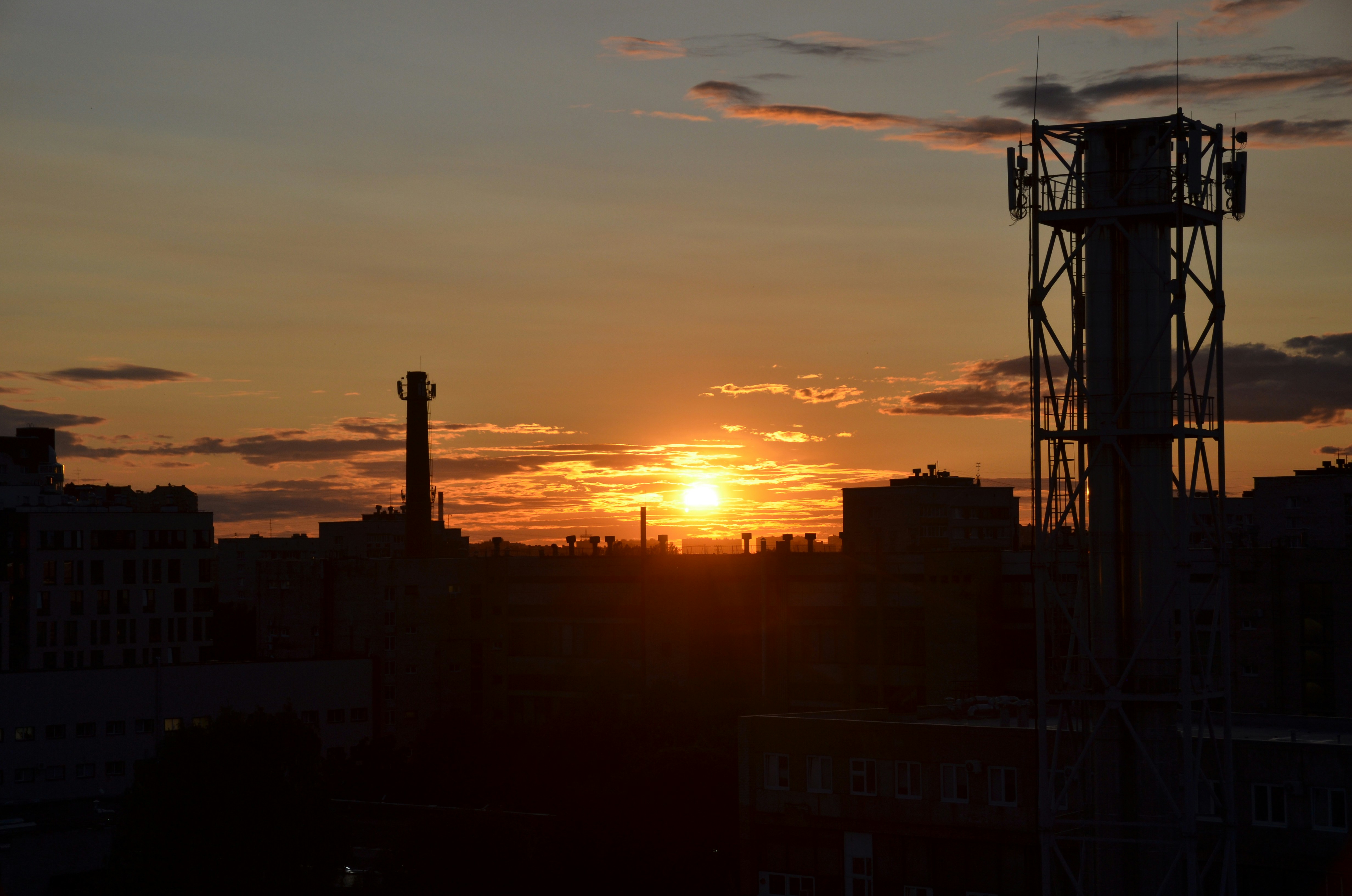 Sunlit Skyline: The City Basks in Evening Glow