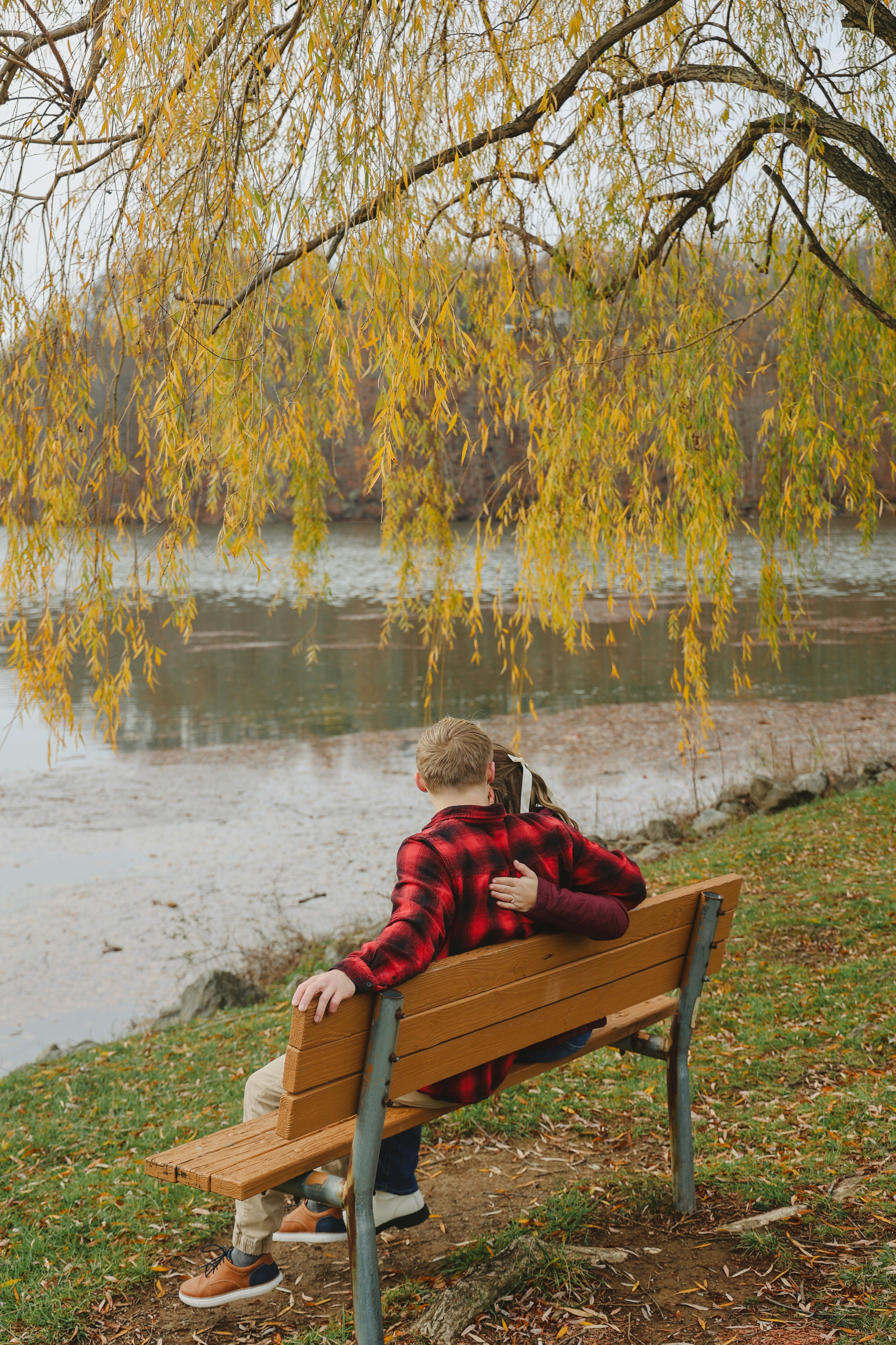 Autumn Recline: Warmth on a Riverside Bench