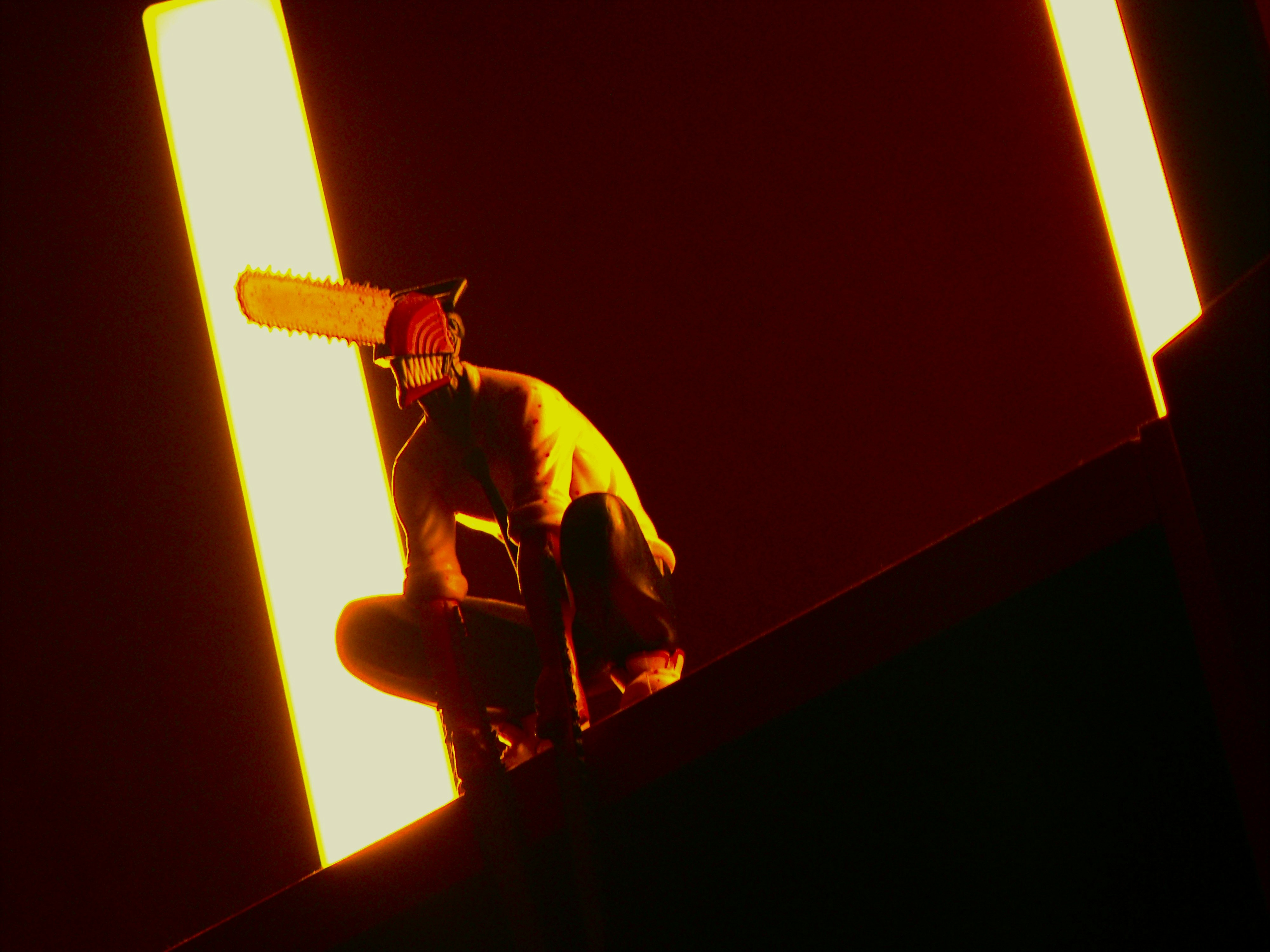 Neon-clad climber on a glowing rooftop ridge