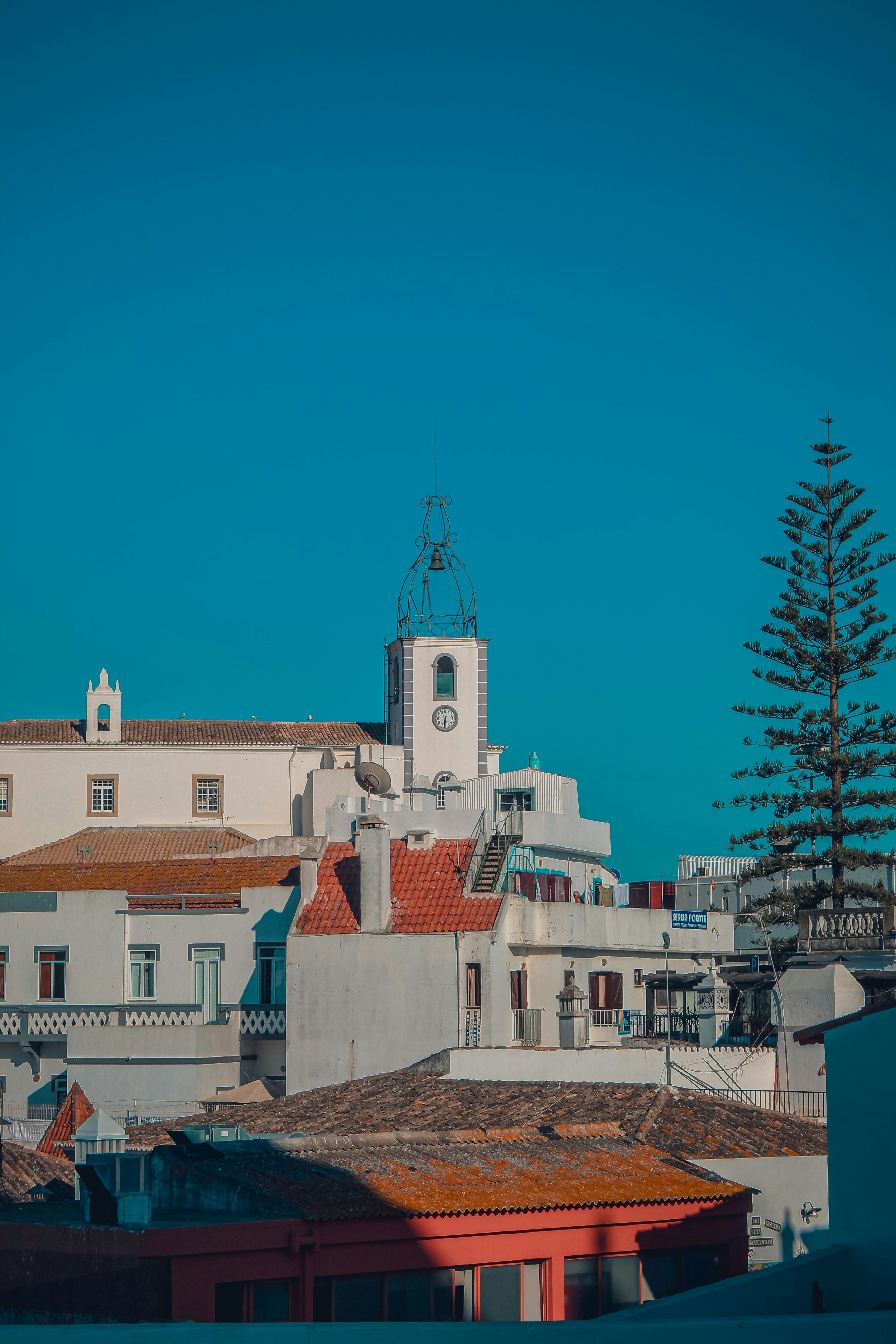 White-washed Town with a Sky-Blue Arc