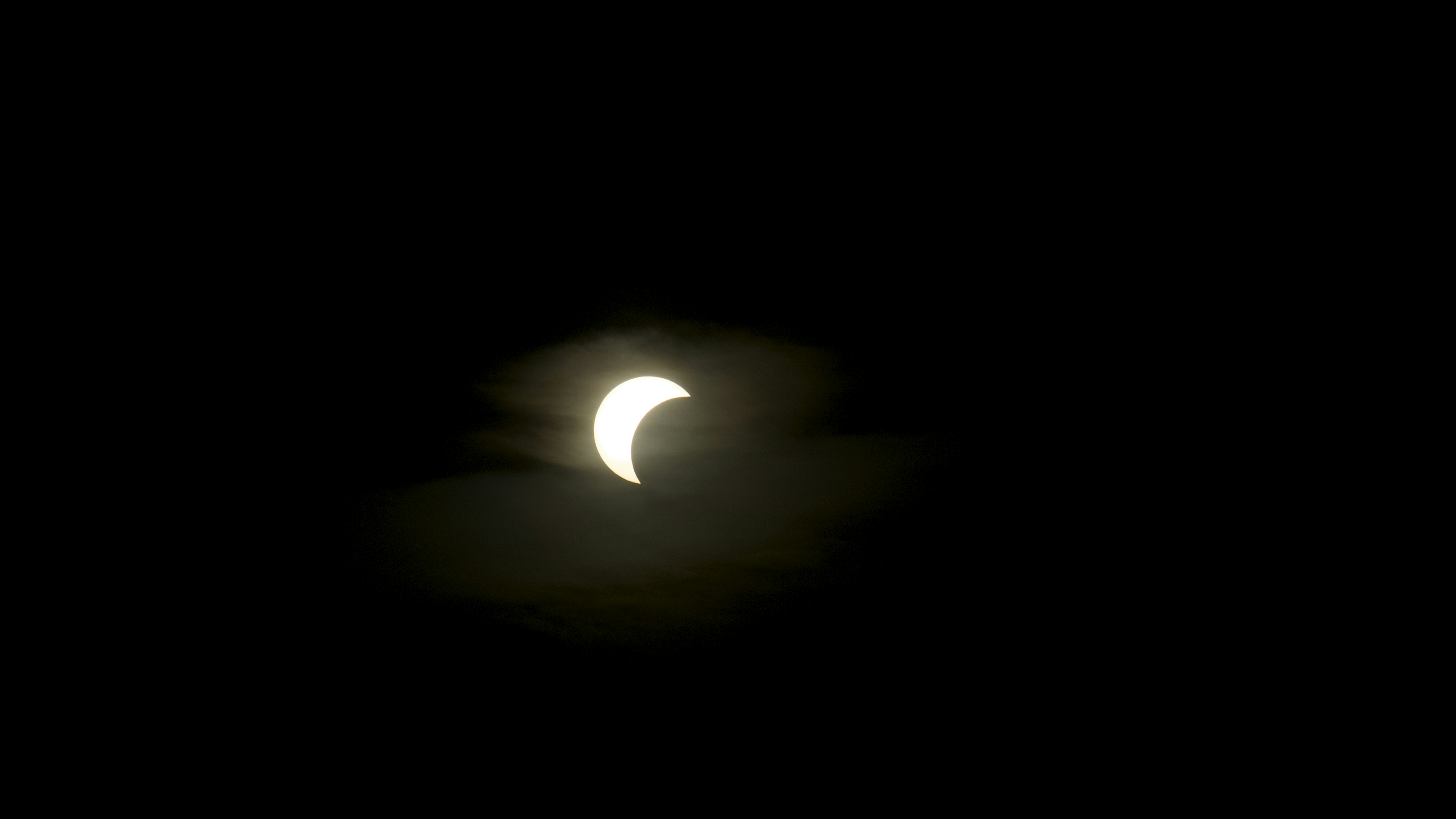 Crescent in the Night: a Quiet Solar Eclipse