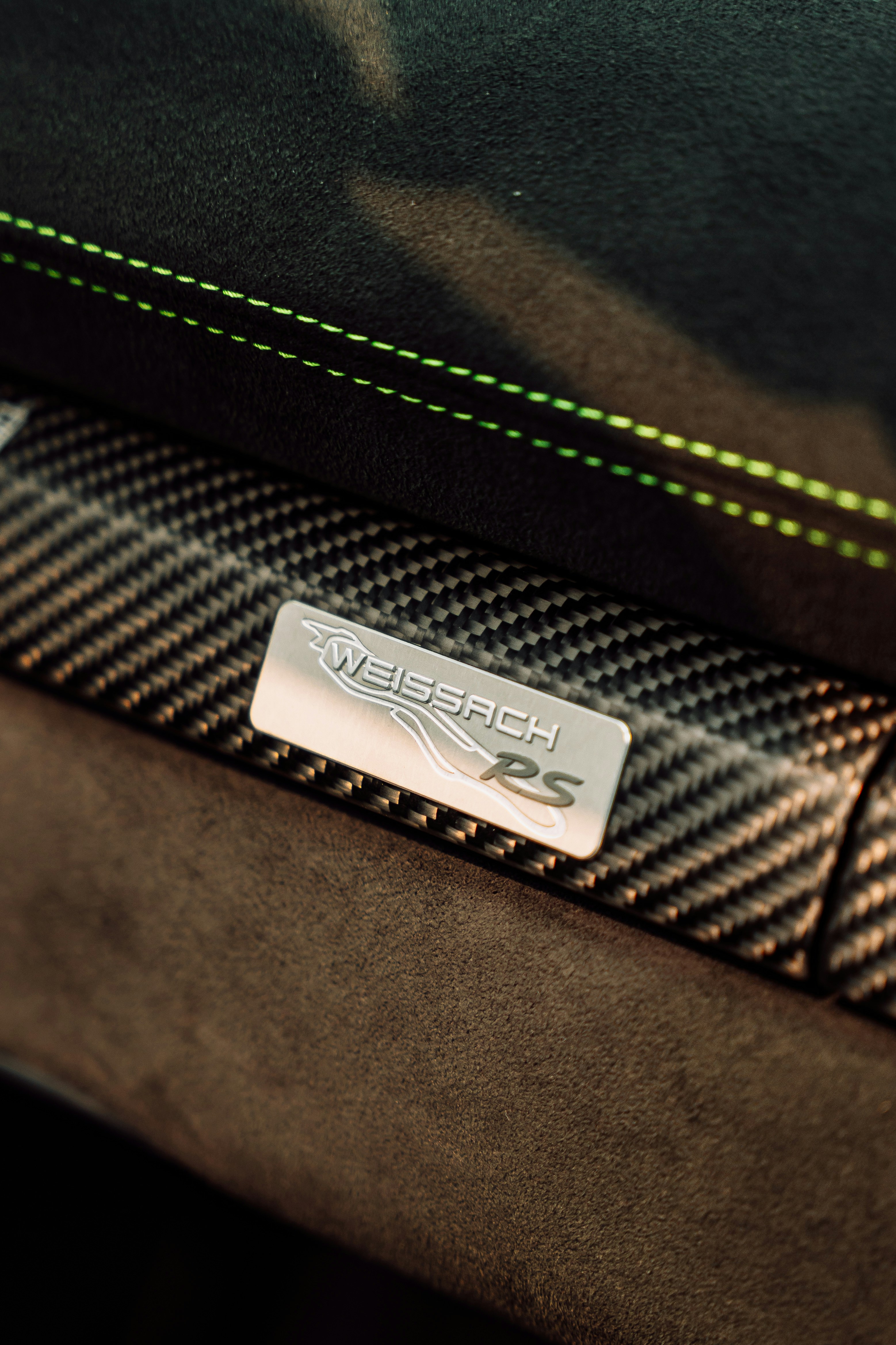 Carbon Fiber Badge of a Sports Car Interior