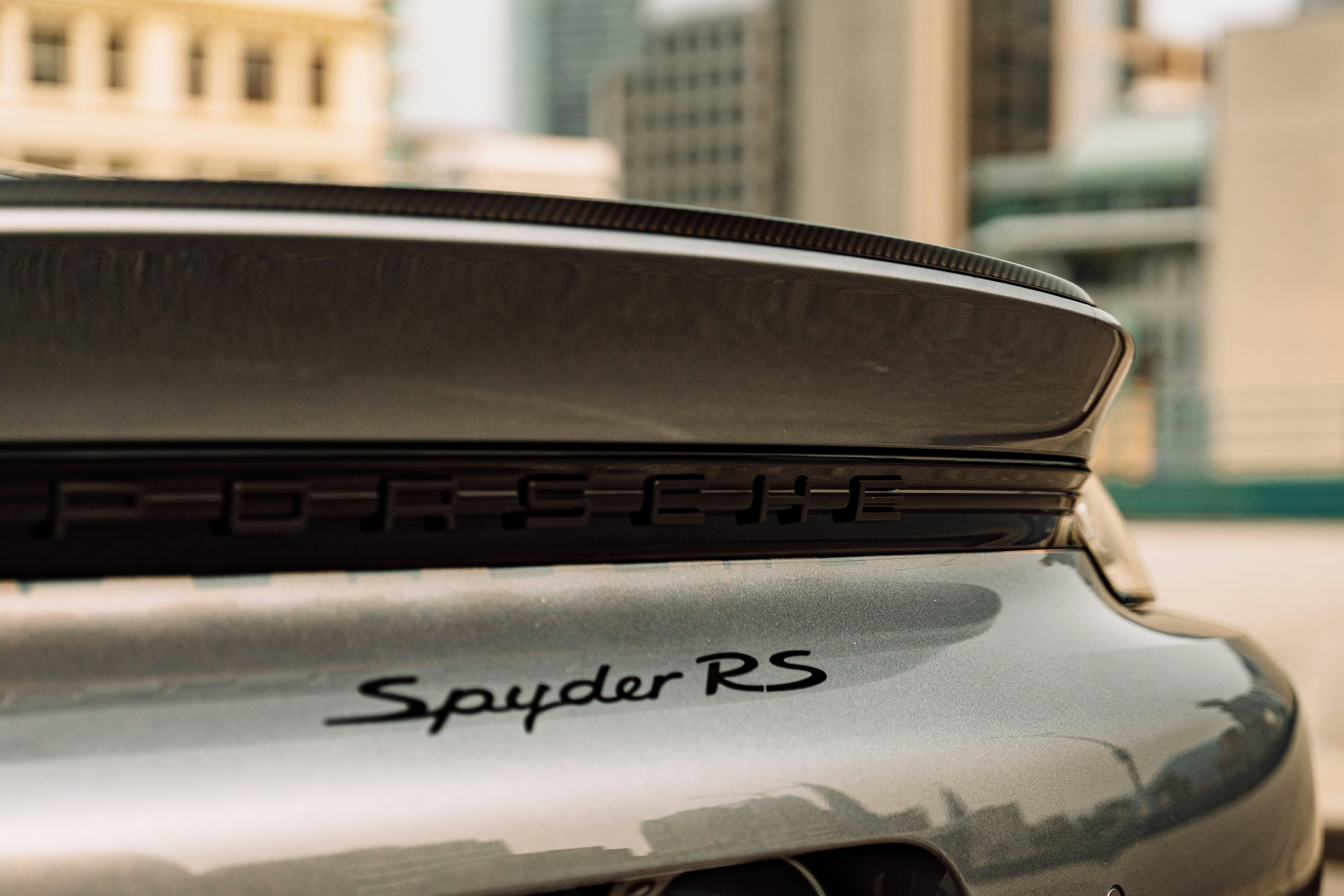 Rear Badge in Motion: A Sporty Porsche Subtly Framed