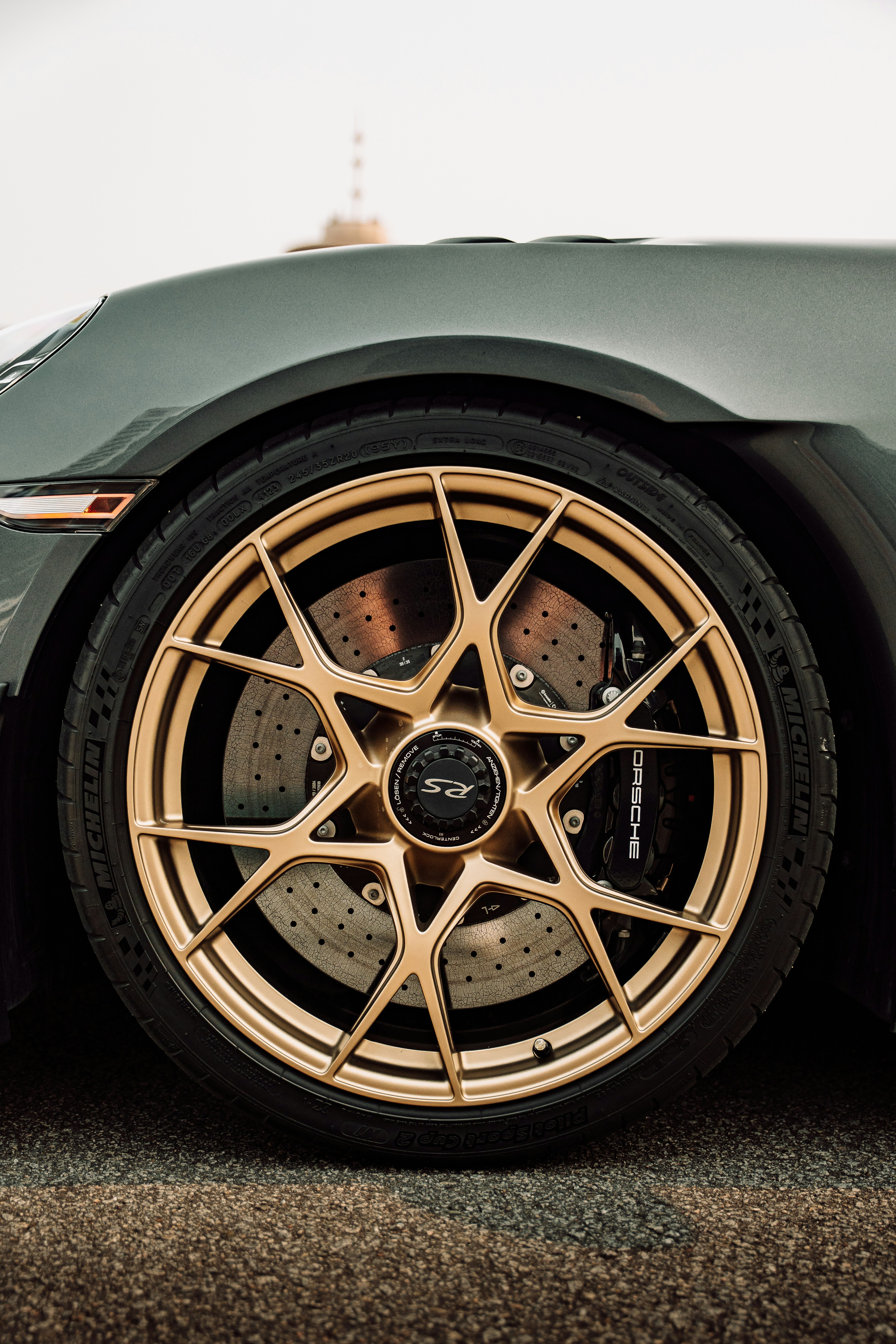 Golden Wheel Precision: A Porsche Rim in Focus