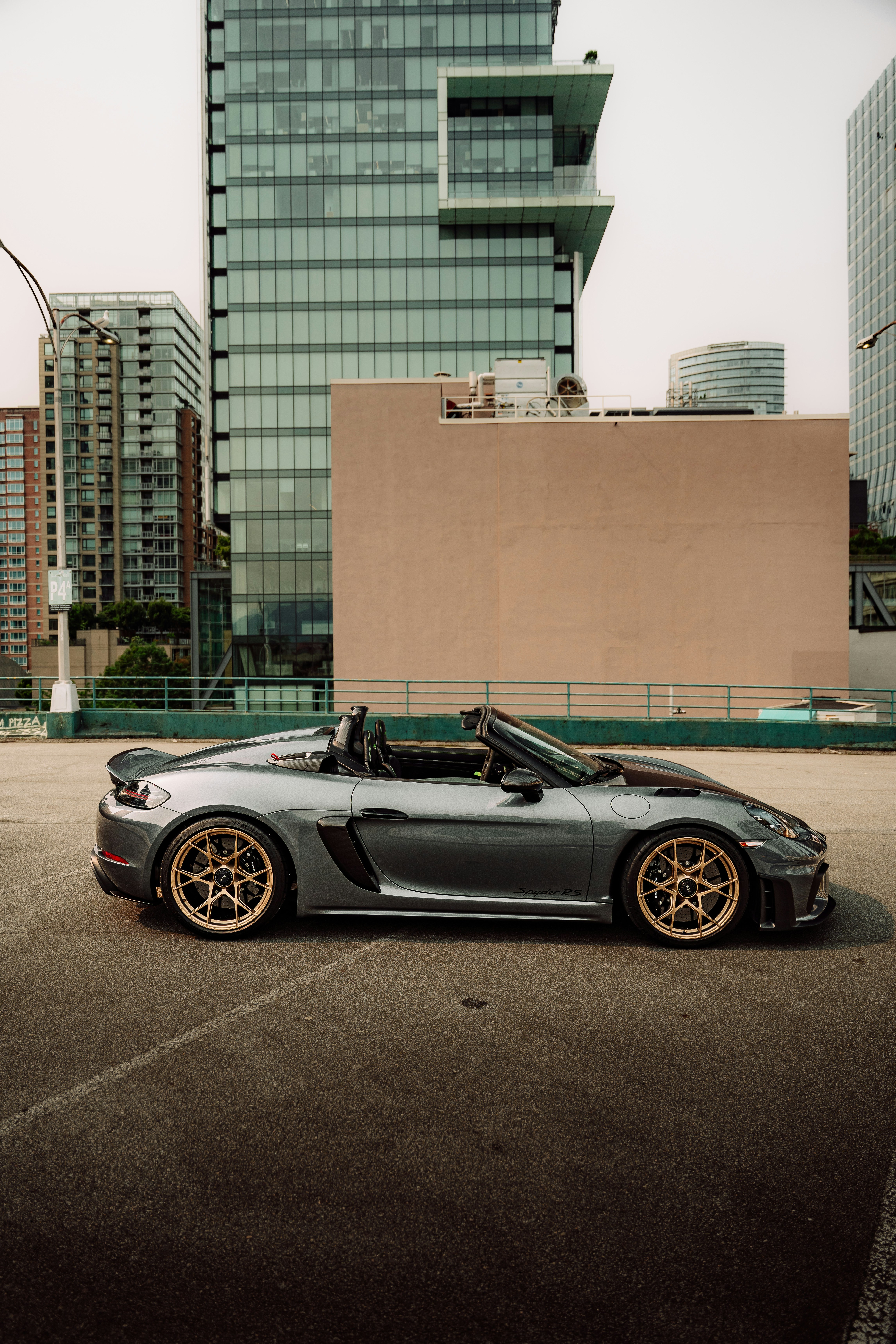 Low-Slung Silver Convertible Meets Urban Monoliths