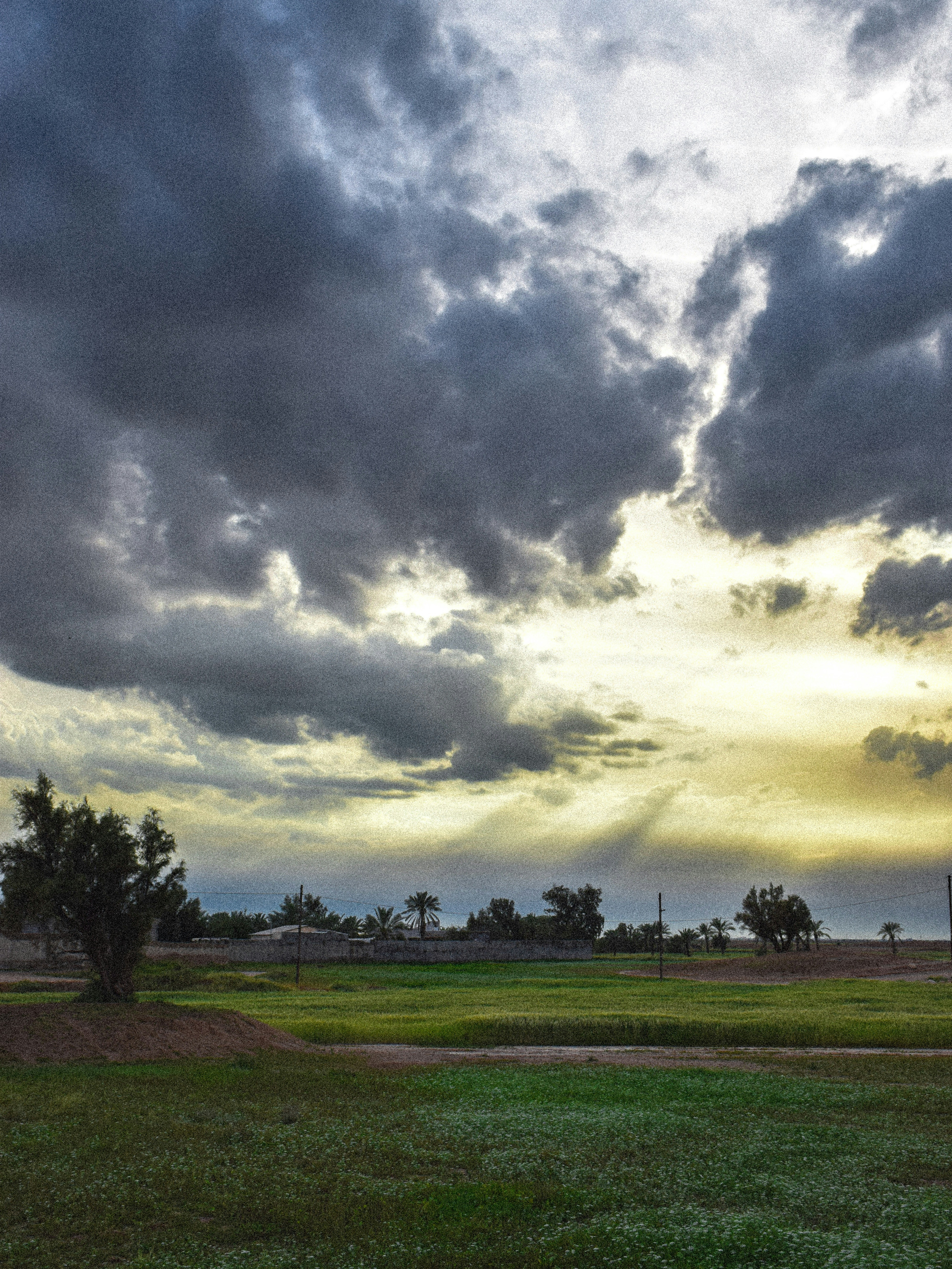 Horizon Breath: Cloudy Sky over Quiet Field at Dusk