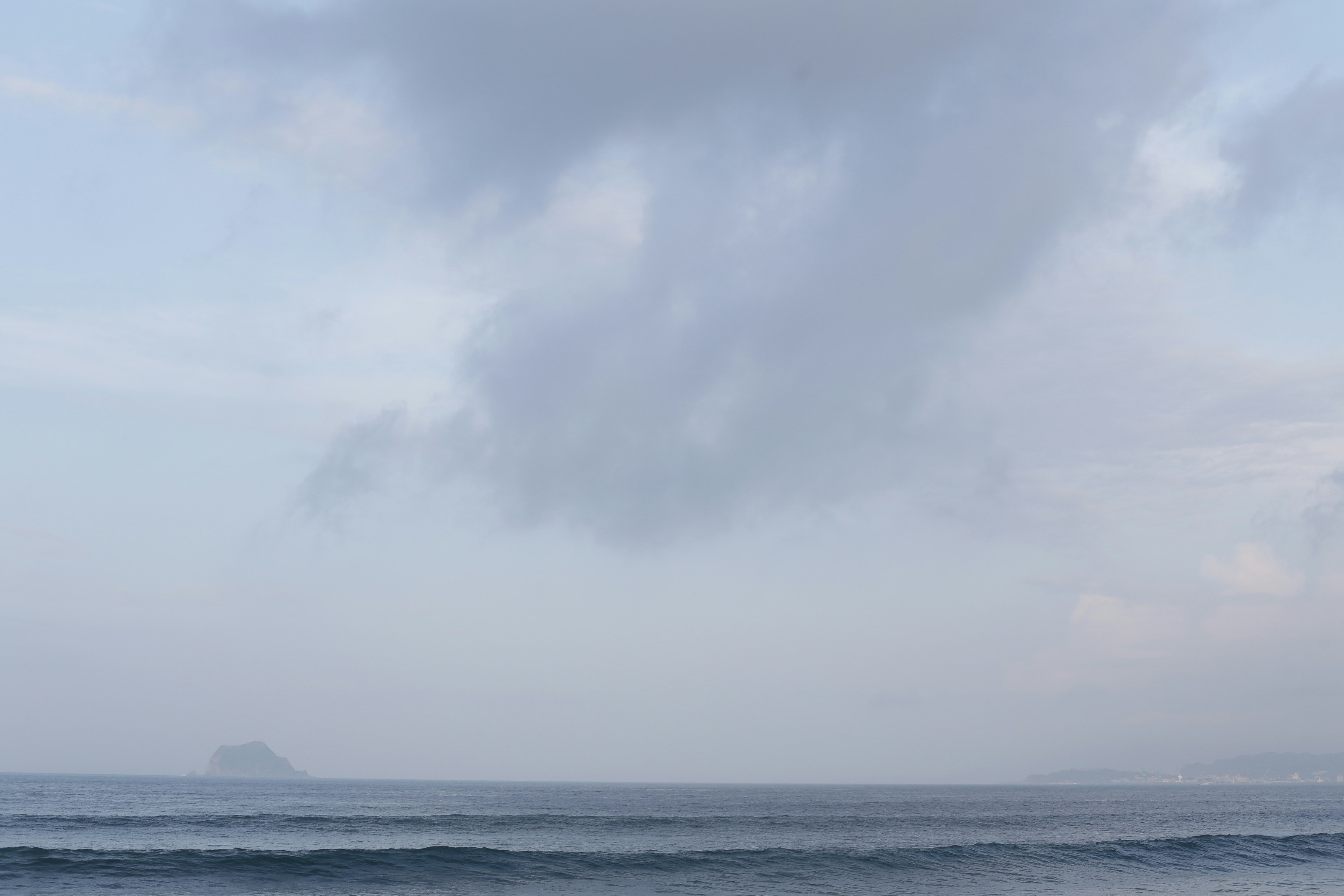 Horizon Whisper: A Quiet Sea Under Soft Clouds