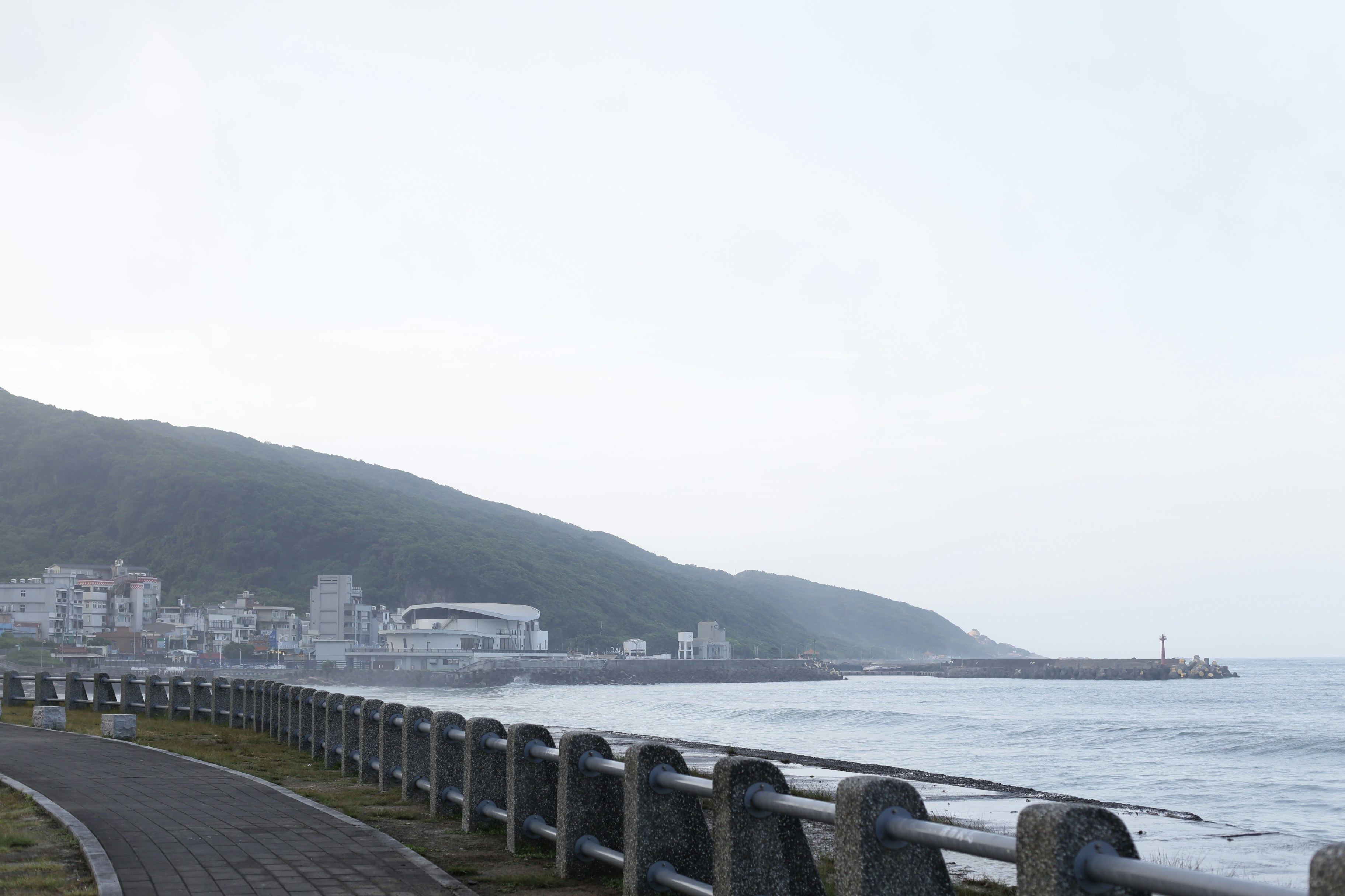 Seaward Promenade with Distant Coastline and Pier