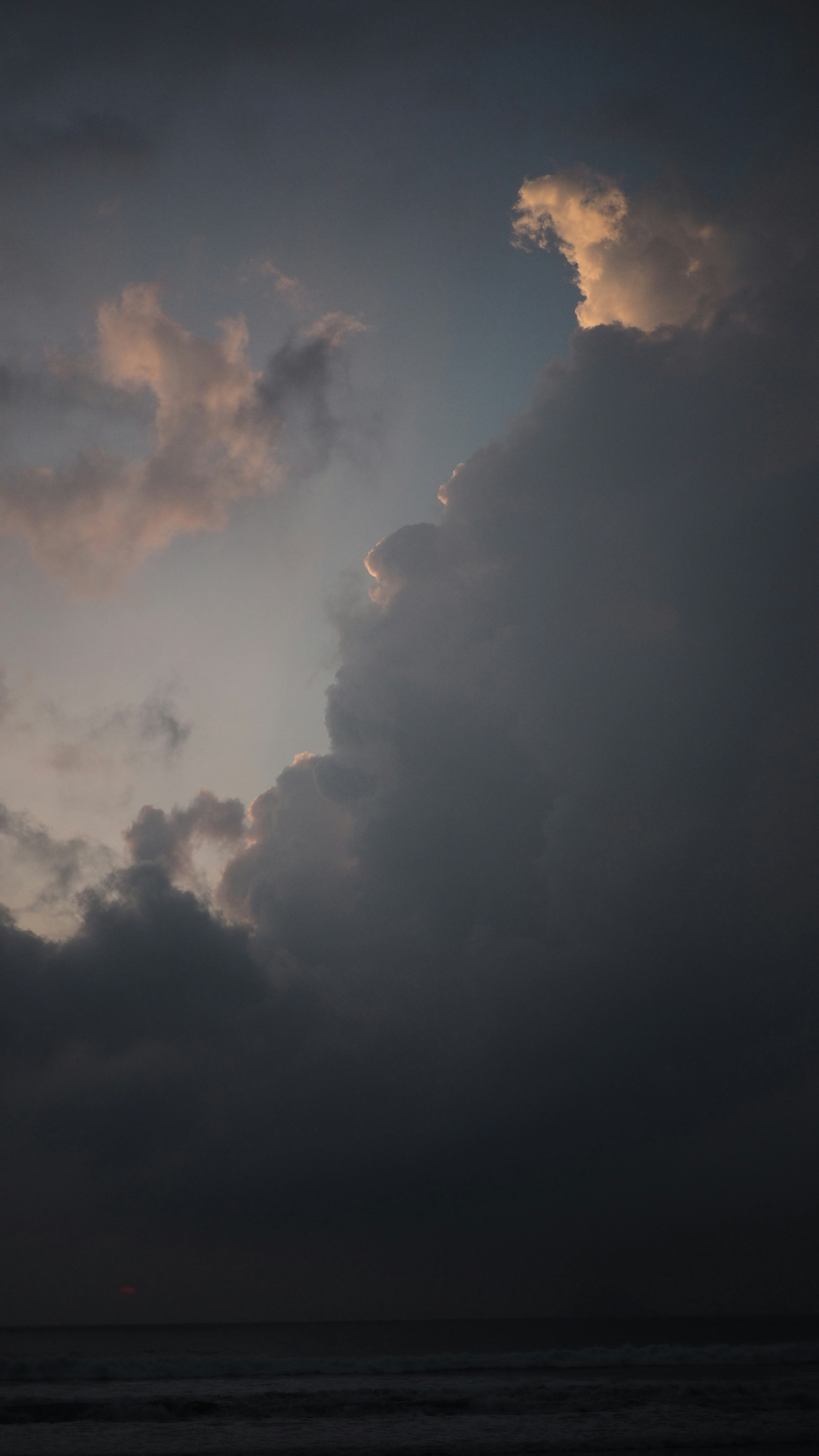 Cobalt Sky Beneath a Rising Torso of Cloud